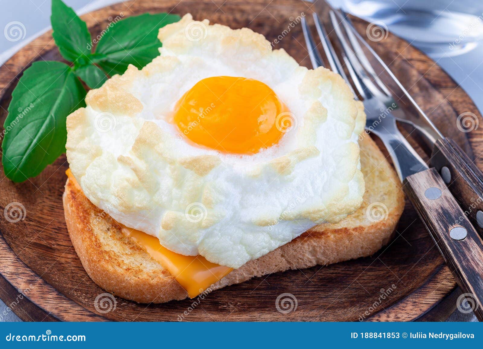 Trendy Cloud or Fluffy Egg Dish on a Wooden Plate, Horizontal Stock ...