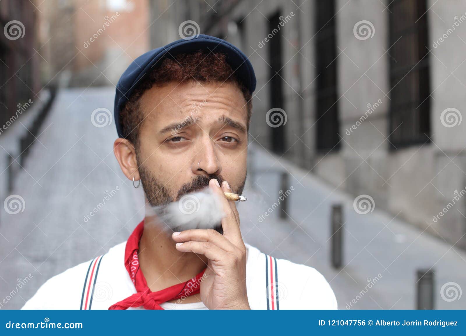 Trendy Ethnic Man Smoking a Joint Outdoors Stock Photo - Image of black ...