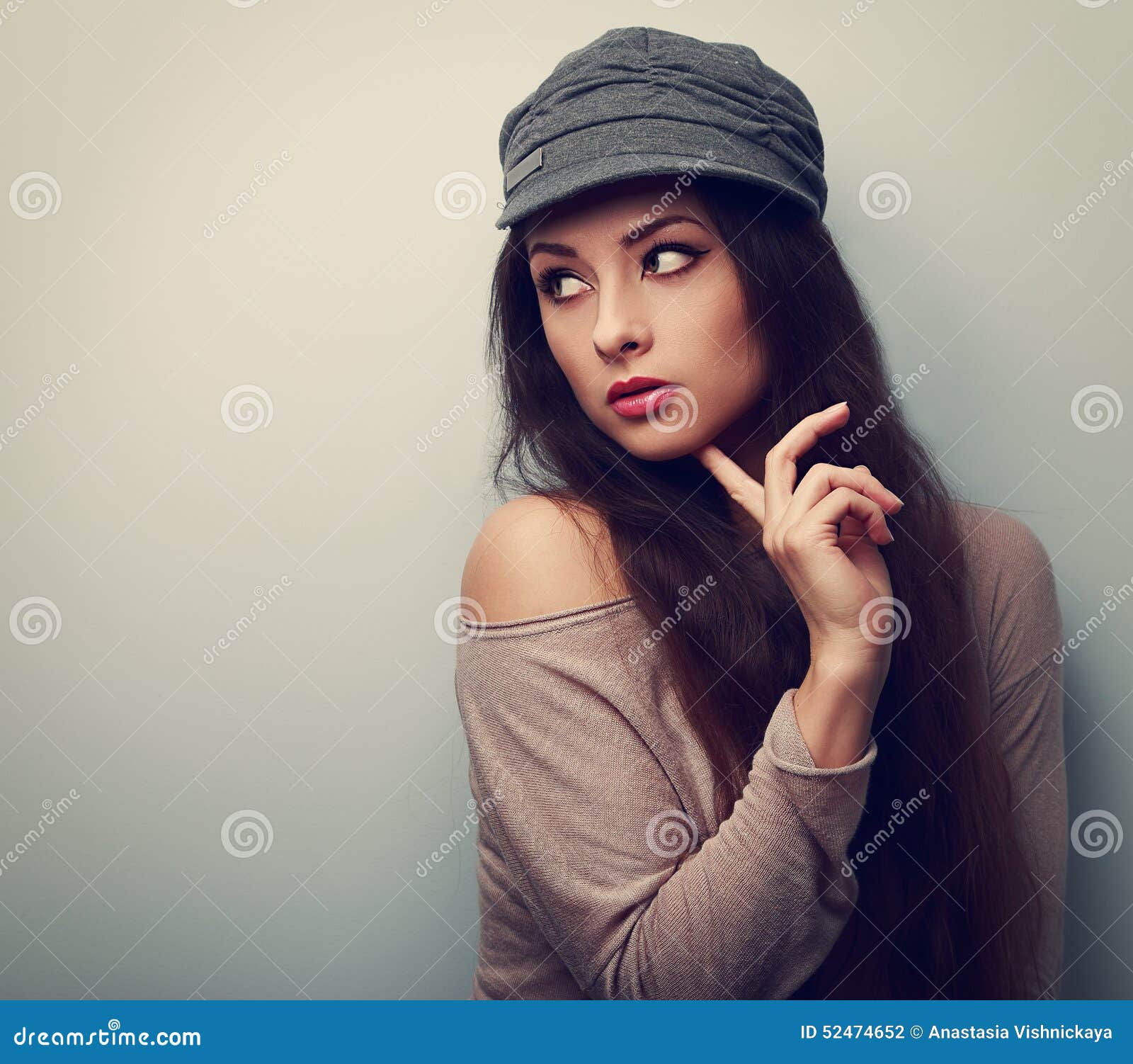 Trendy Thinking Female in Cap Looking. Vintage Color Portrait Stock ...