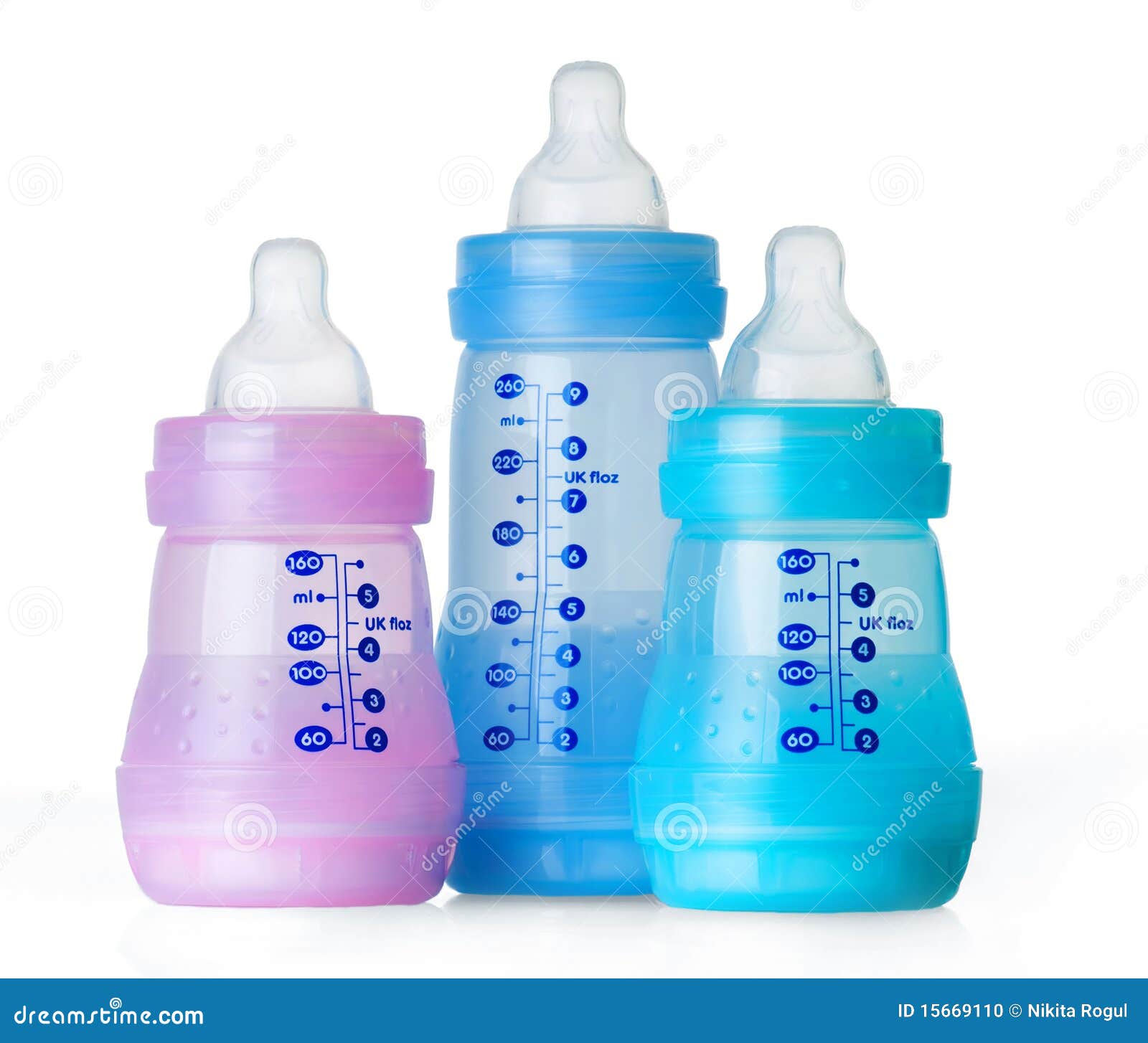 Tres botellas de bebé foto de archivo. Imagen de color - 15669110