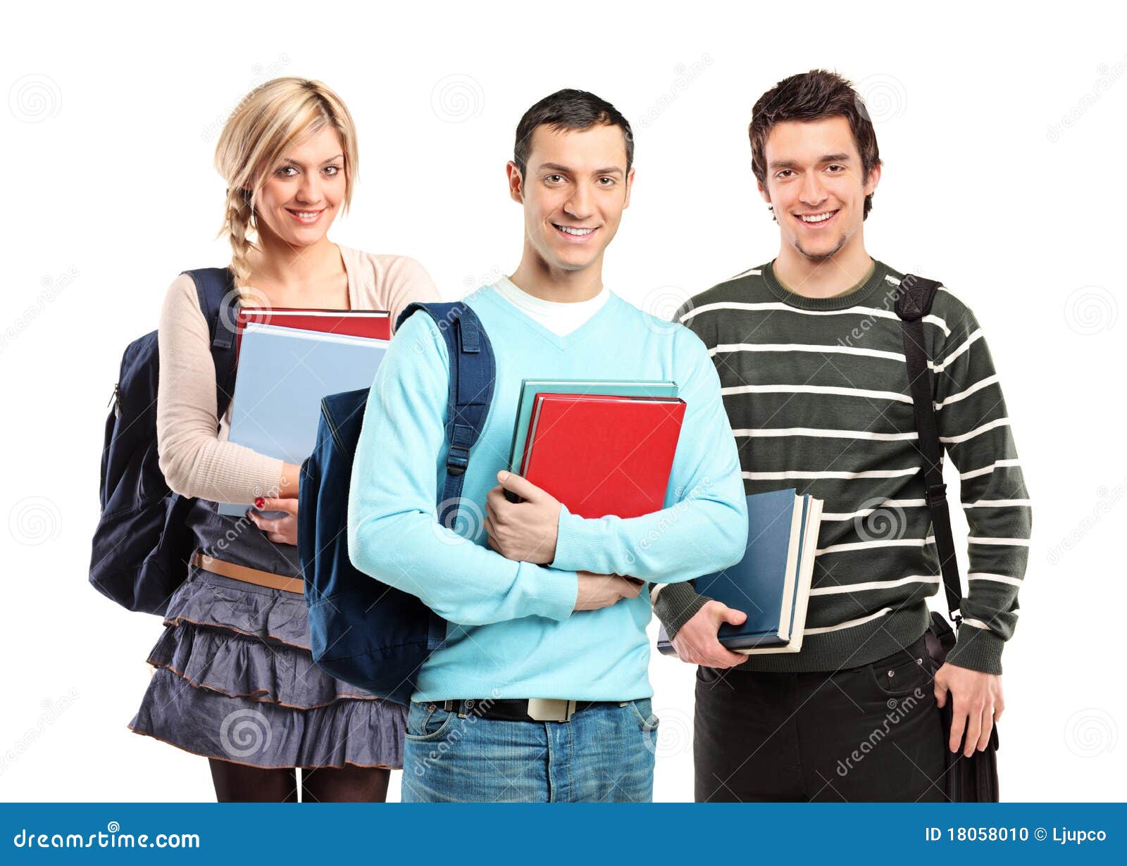 Tres Estudiantes Que Presentan Con Los Libros Foto de archivo - Imagen ...