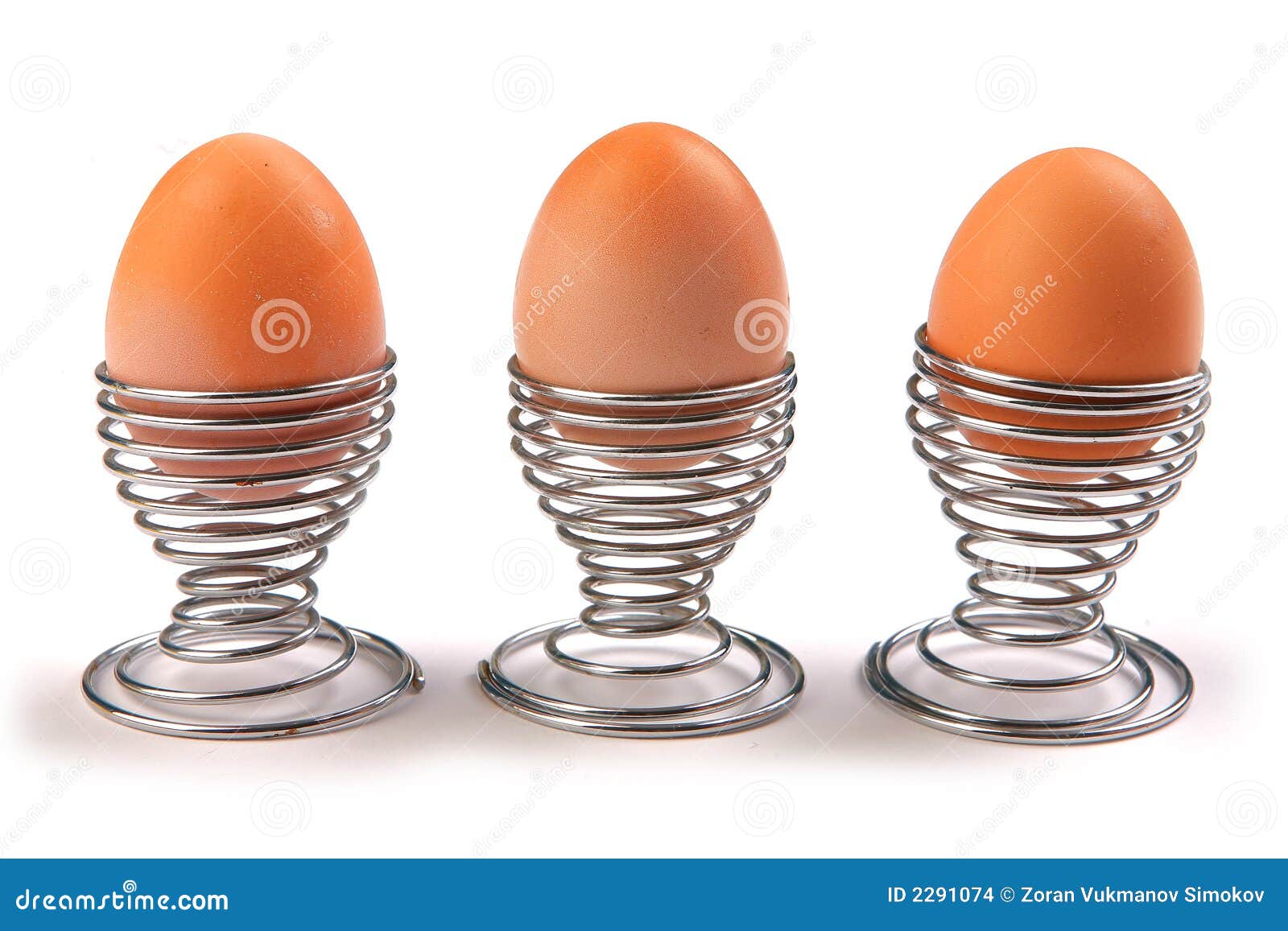 Tres huevos foto de archivo. Imagen de sostenedor, fondo - 2291074