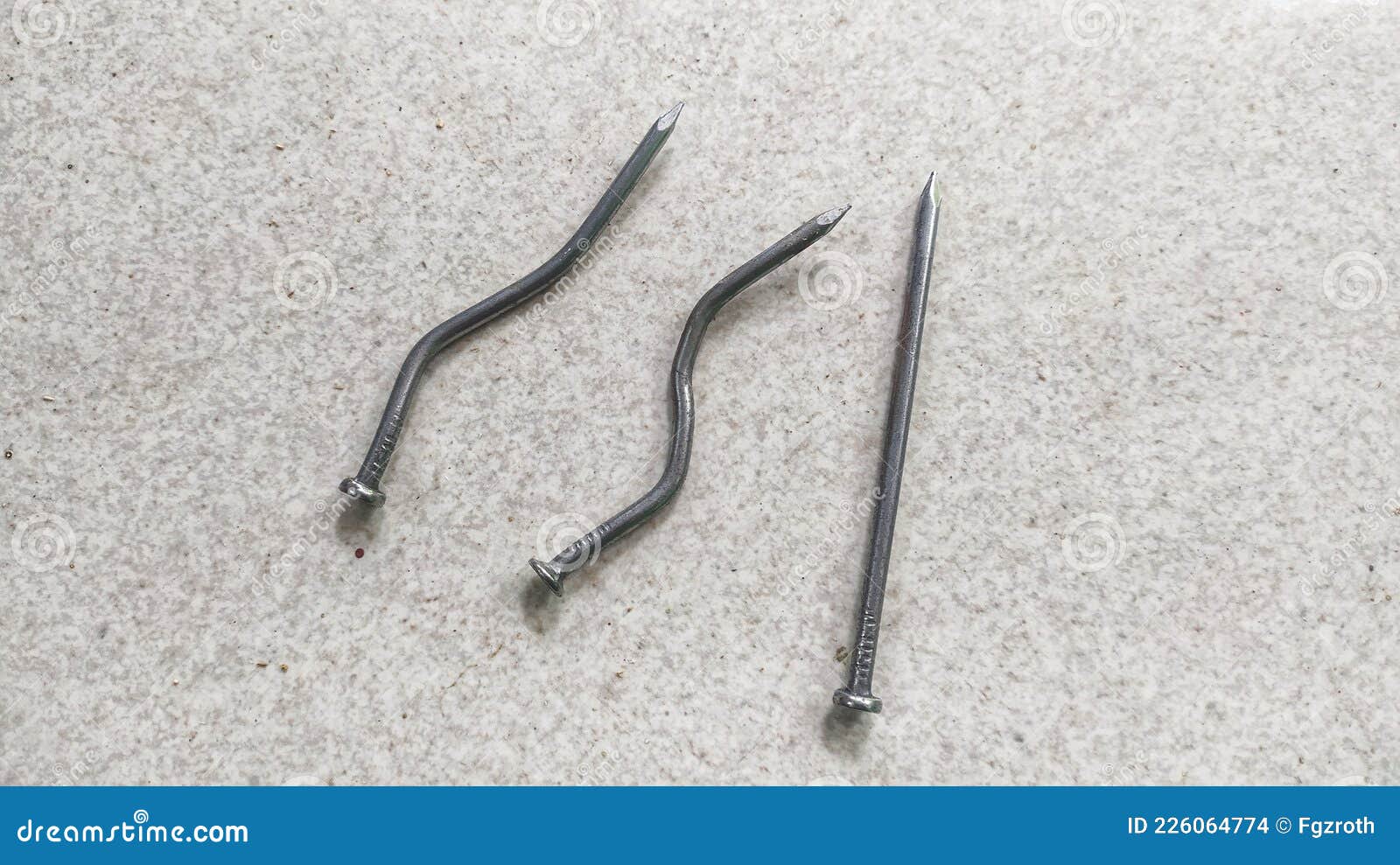 Three nails on the floor stock photo. Image of weapon - 226064774