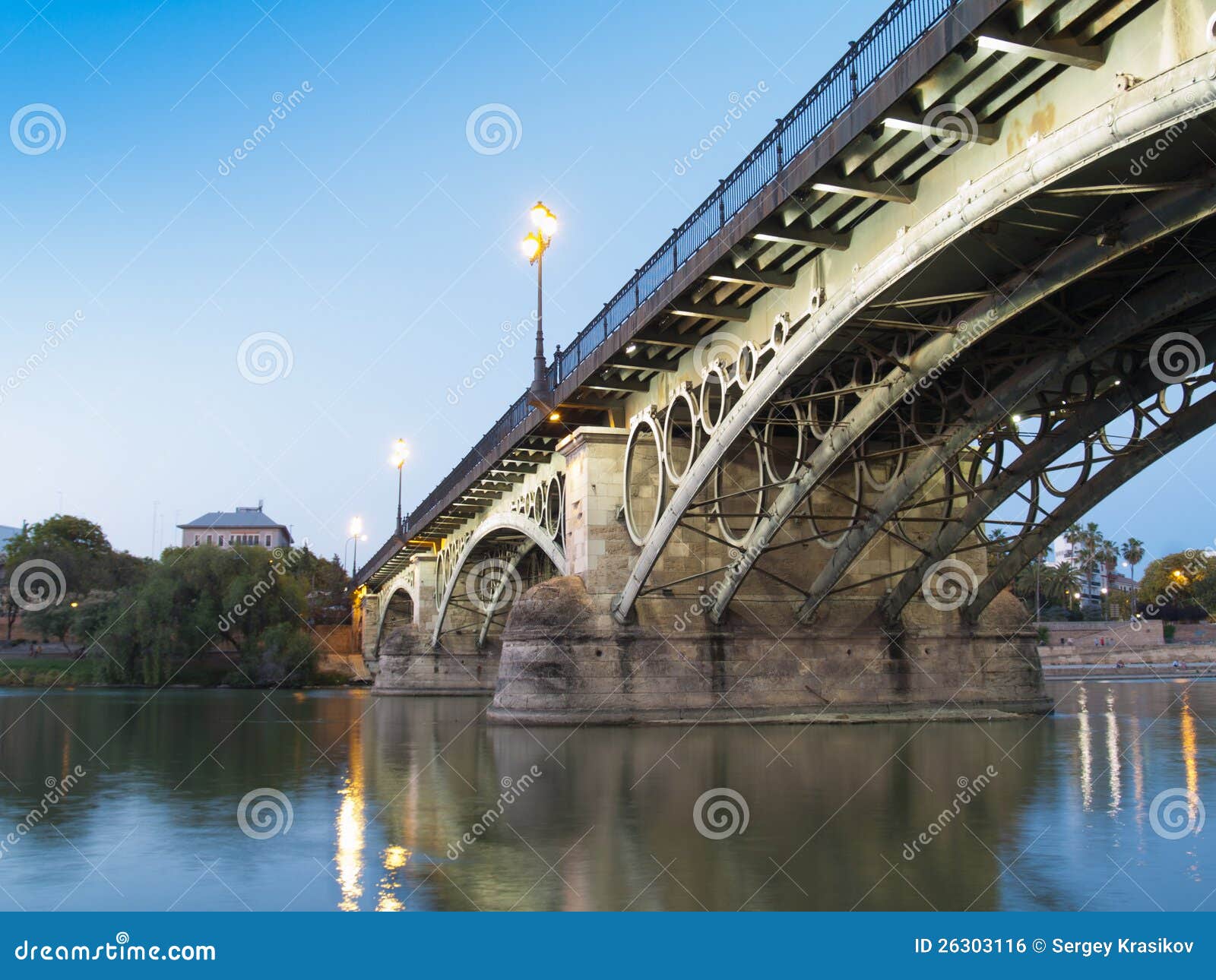 Triana Bridge, Seville at Twilight Stock Photo - Image of reflection ...