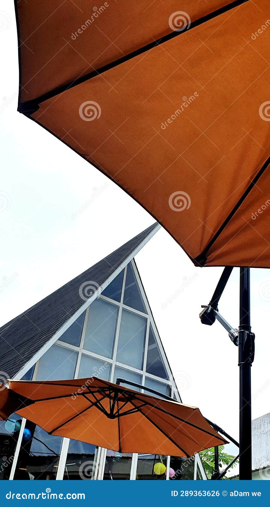 Triangle Building Cafe with Cozy Brown Big Umbrella Stock Photo - Image ...