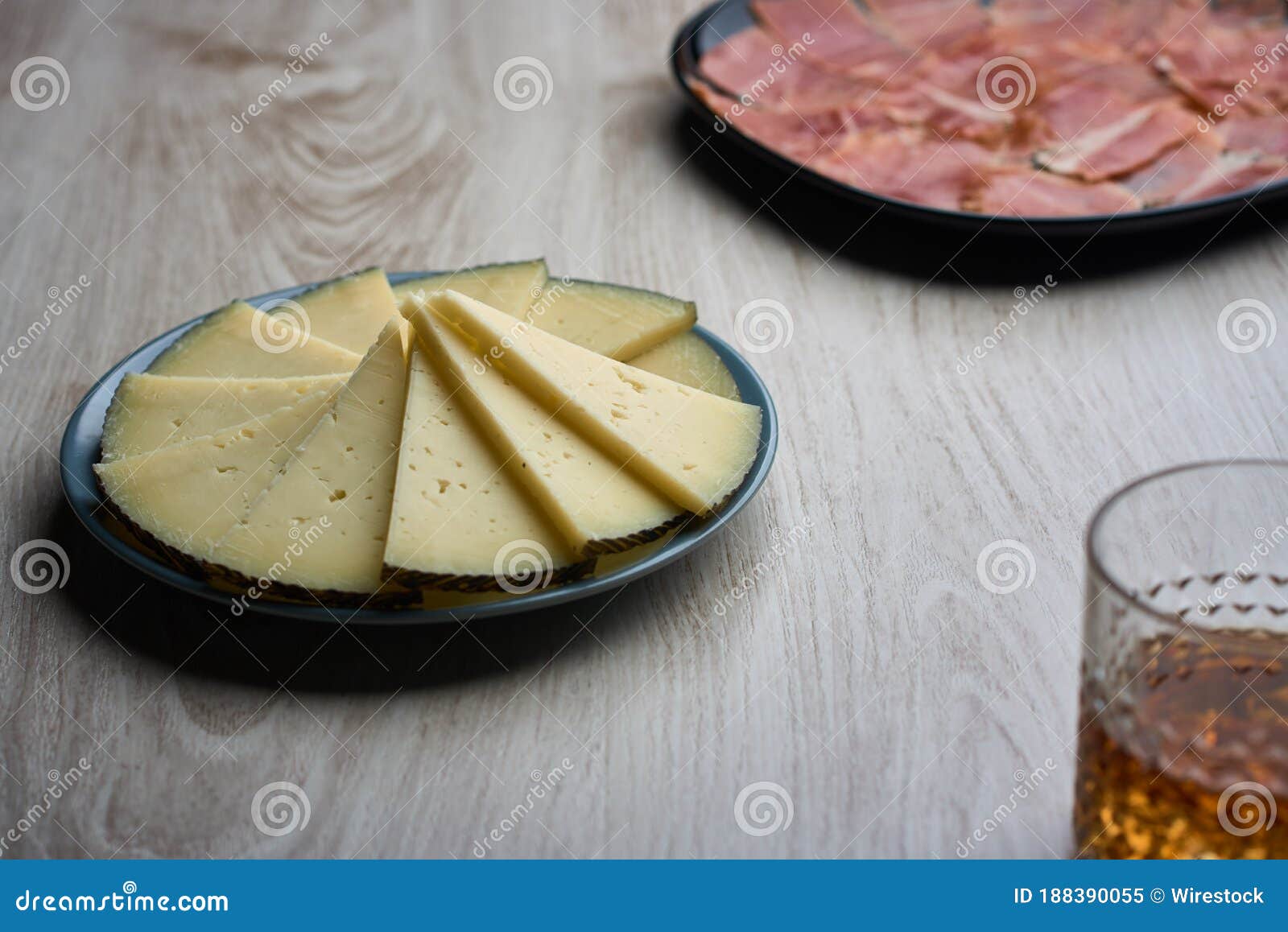 Triangle Cheese Slices on a Plate on a Wooden Surface Stock Image ...
