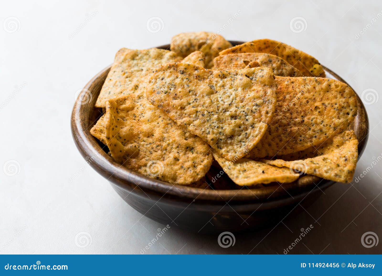 Triangle Corn Chips with Poppy Seeds Stock Photo - Image of bowl, chip ...