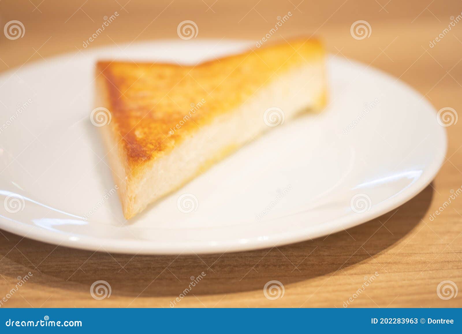 Triangle of Garlic Bread on White Dish Stock Image - Image of italian ...