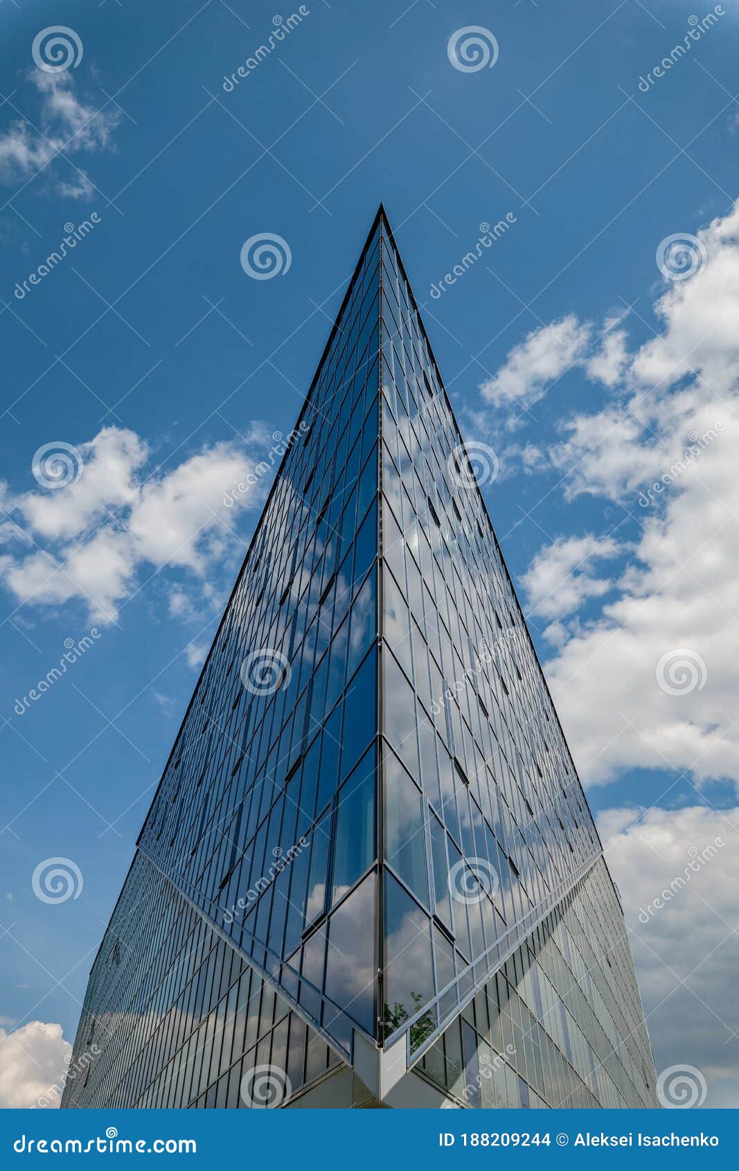 Triangle Glass Building with Reflection of Clouds Stock Photo - Image ...