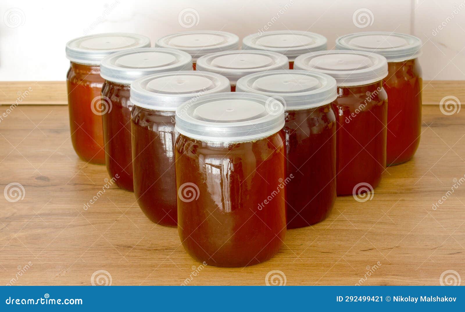 A Triangle of Honey Jars on the Table. Fresh Honey is Packaged in Jars ...