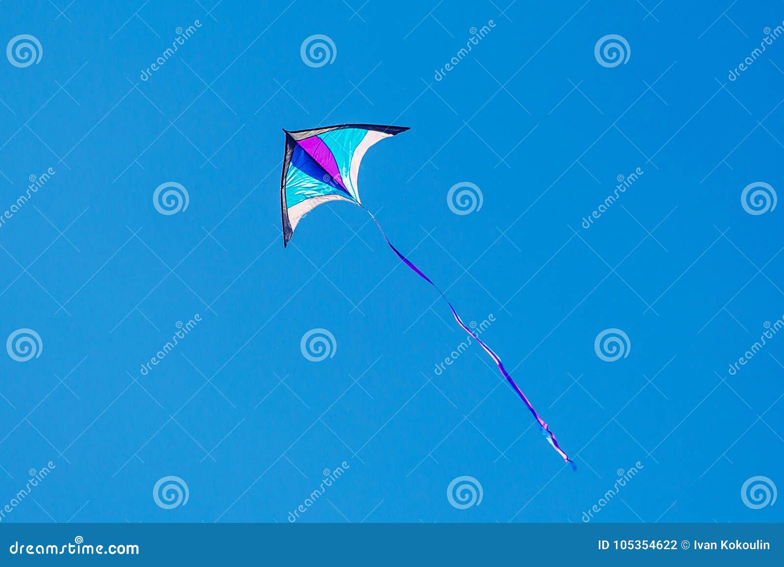 Triangle Kite Flying on a Sunny Day Stock Photo - Image of colors ...
