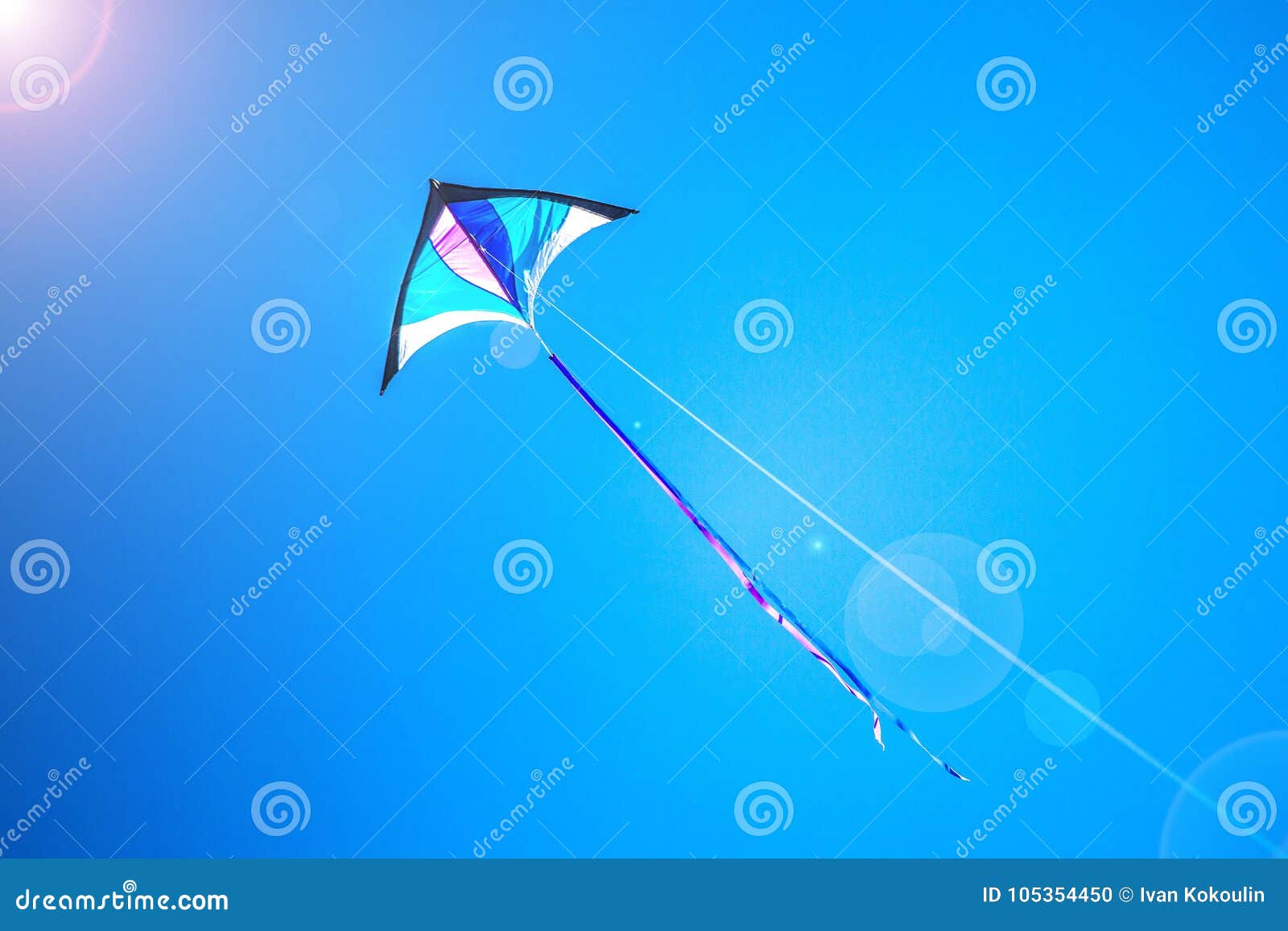 Triangle Kite Flying on a Sunny Day Stock Photo - Image of flight ...
