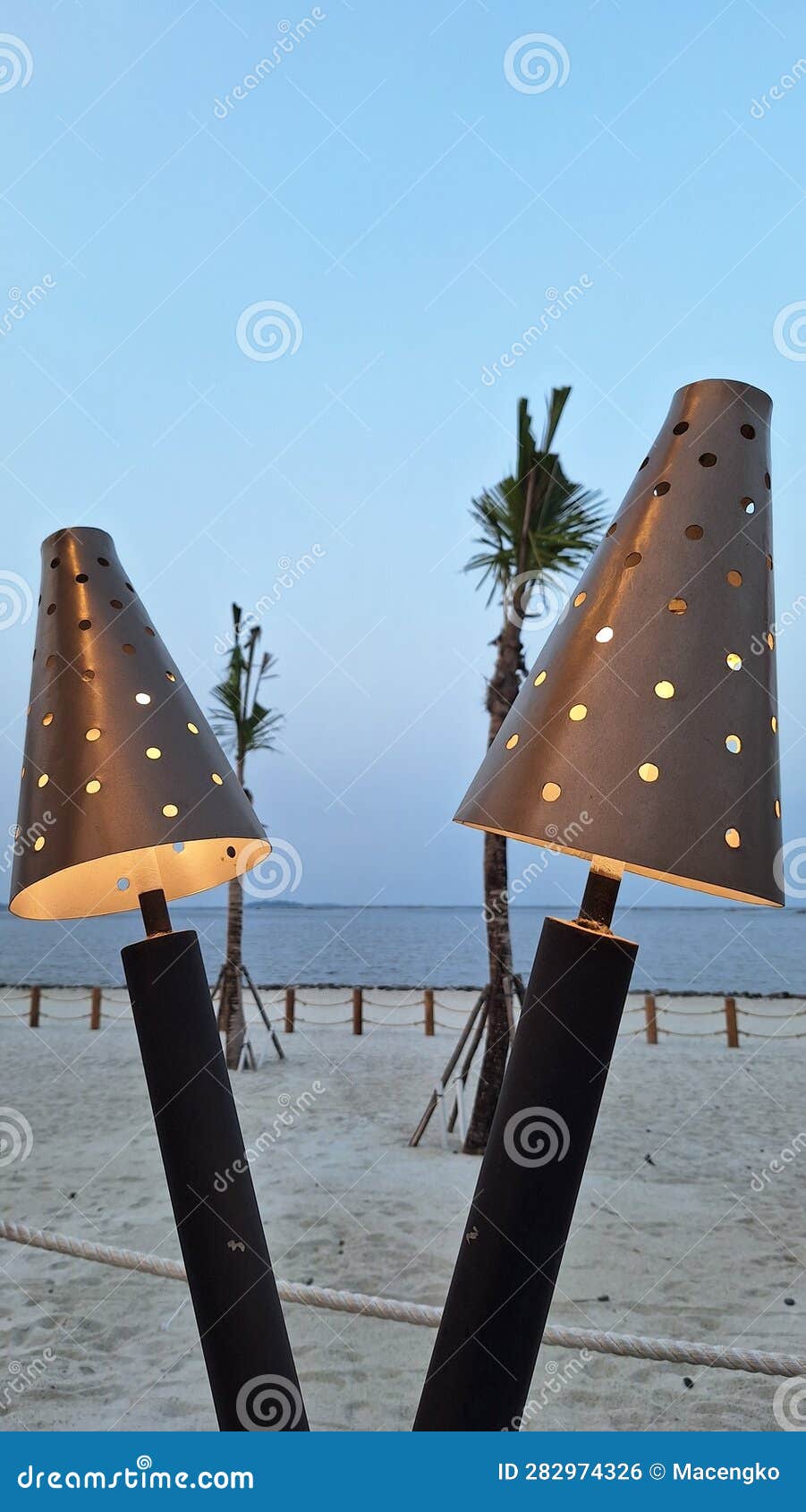 Triangle Lamp on the beach stock photo. Image of beach - 282974326