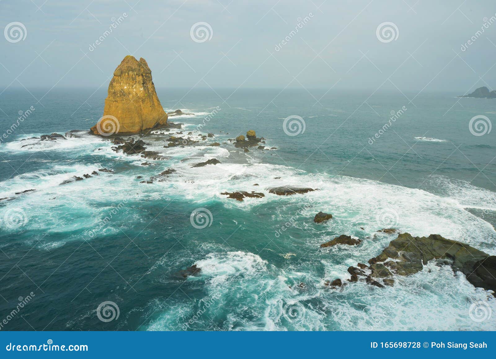 Triangle Rock at Middle of the Sea with White Wave Stock Photo - Image ...