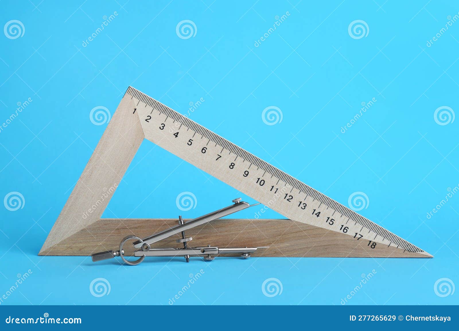Triangle Ruler and Compass on Light Blue Background Stock Image - Image ...