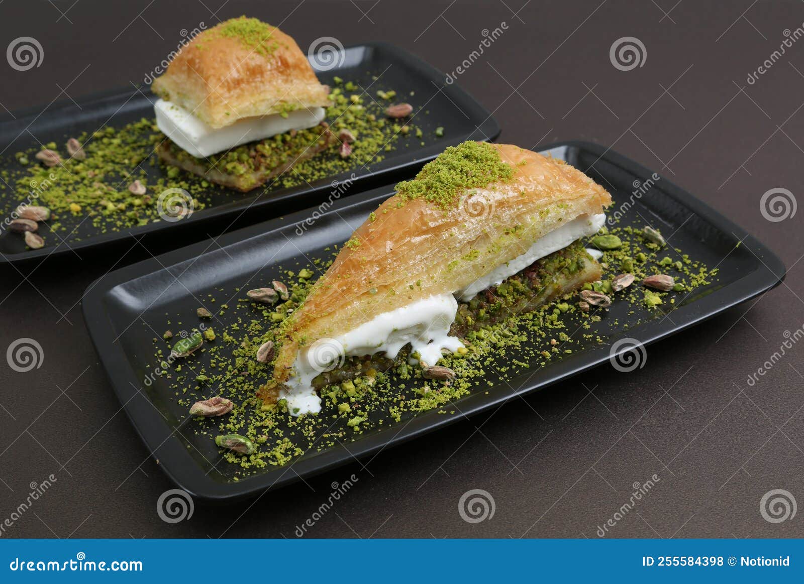 Triangle Shaped and Big Baklava with Ice Cream and Pistachio Stock ...