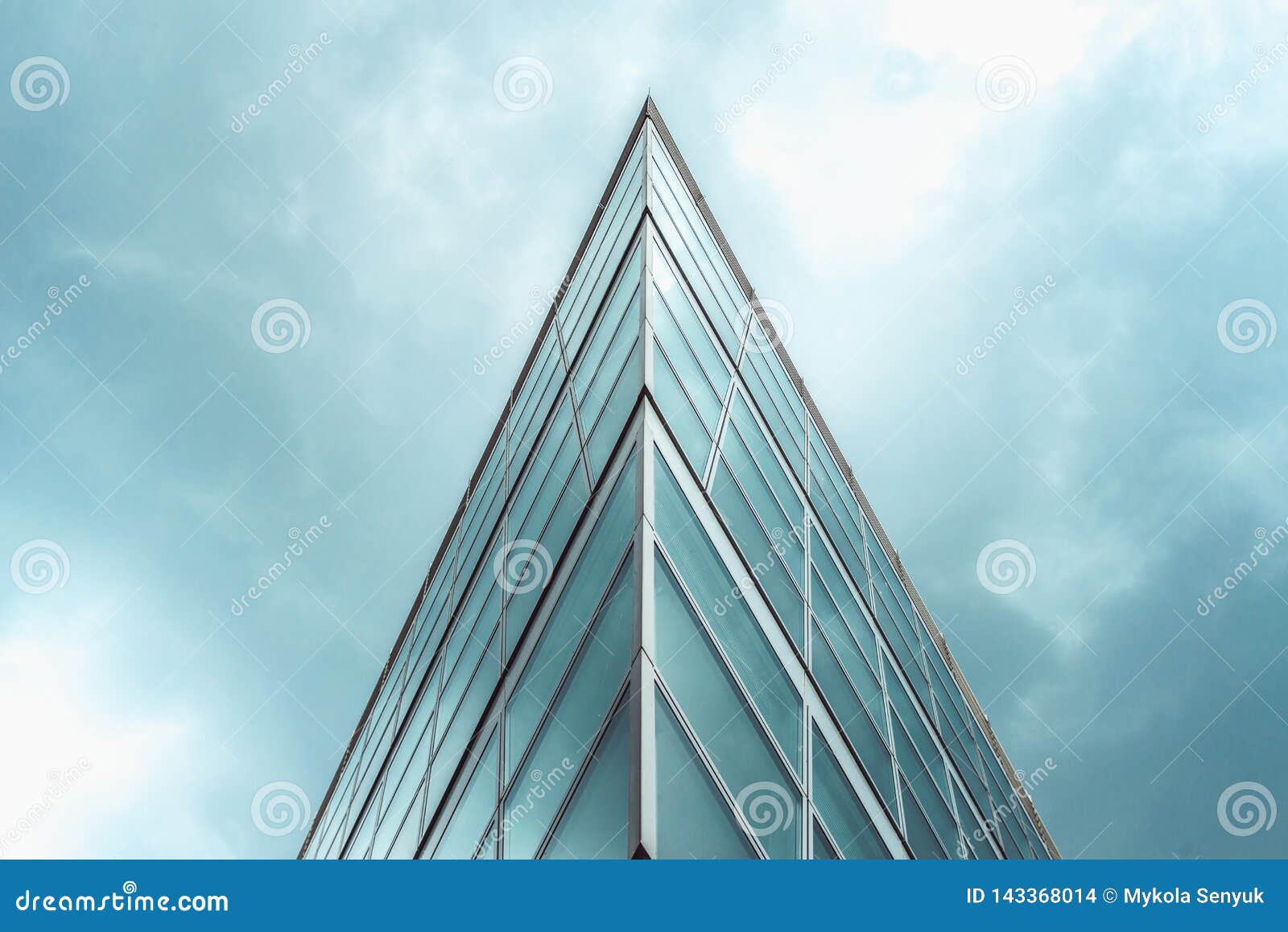 Triangle Shaped Structure Against a Blue Cloudy Sky Stock Photo - Image ...