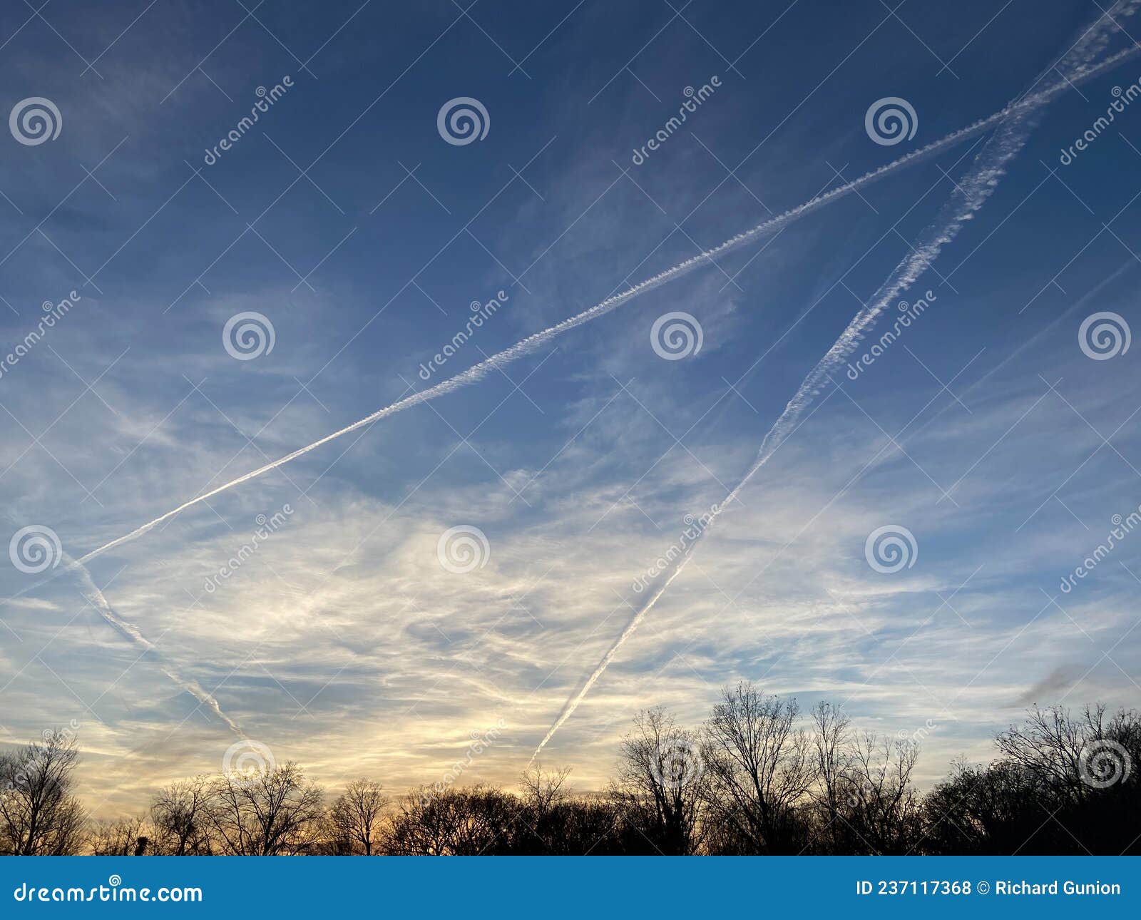 Triangle in the Sky at Sunset Stock Photo - Image of contrails, white ...