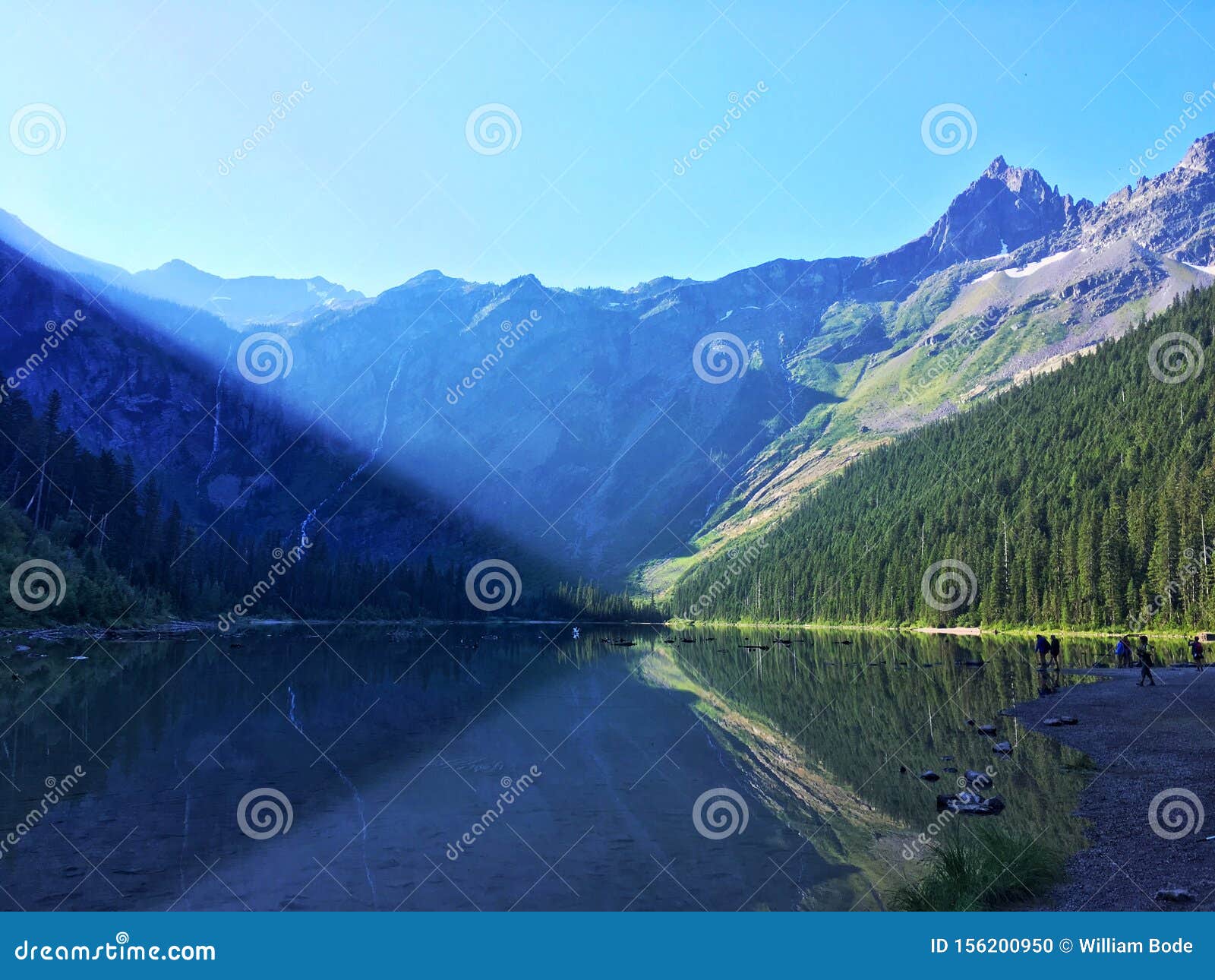 Triangle Sun Rays on Avalanche Lake Stock Photo - Image of lake ...