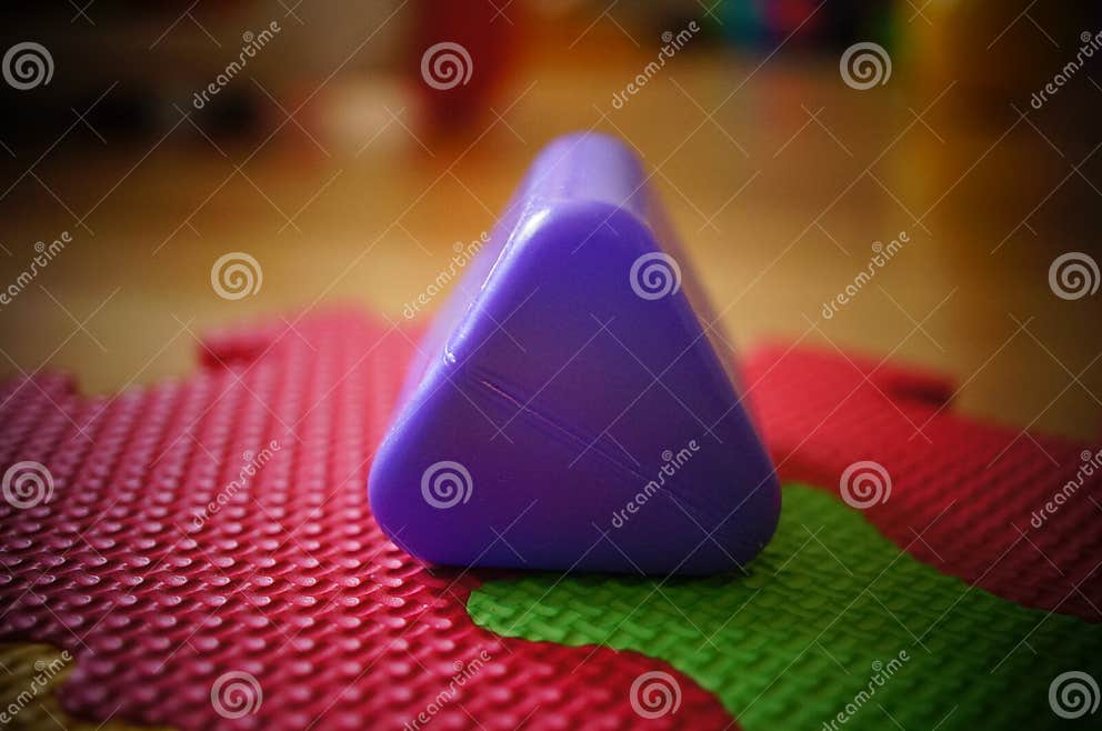 Triangle toy stock photo. Image of object, triangle, plastic - 51879444