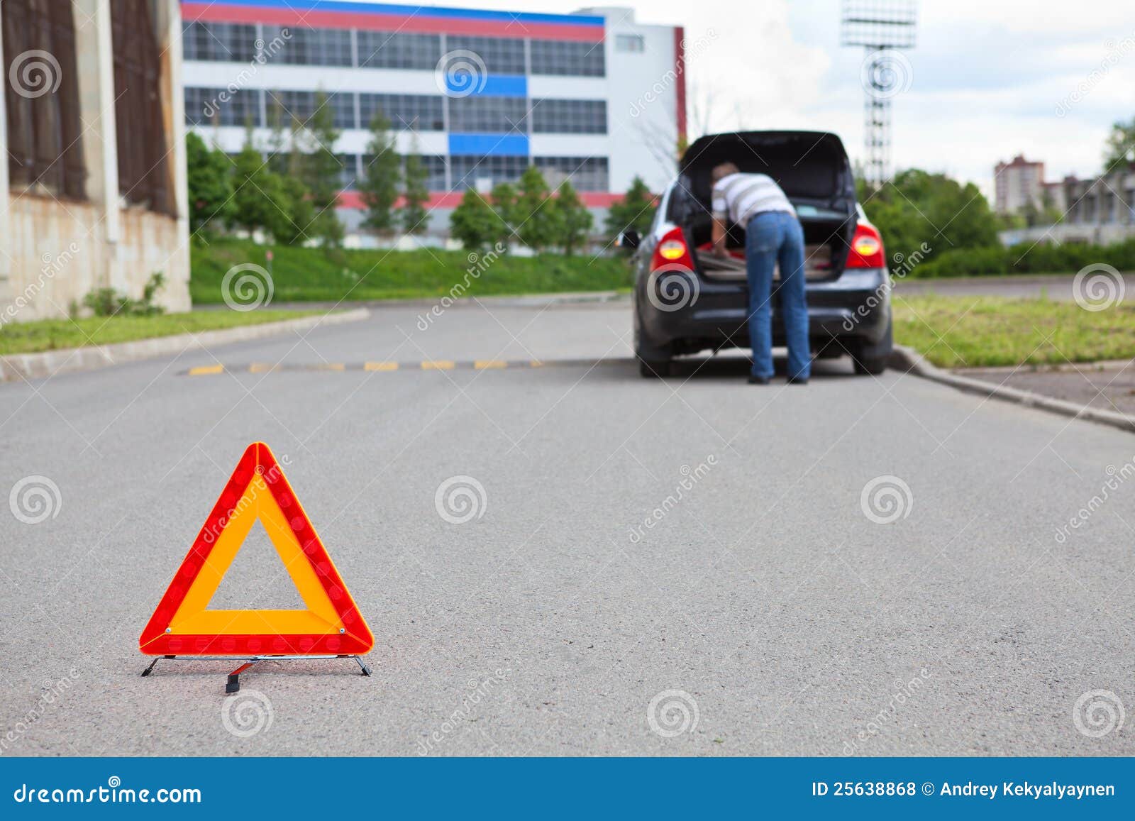 Triangle Warning Sign on Road with Driver in Car Stock Photo - Image of ...