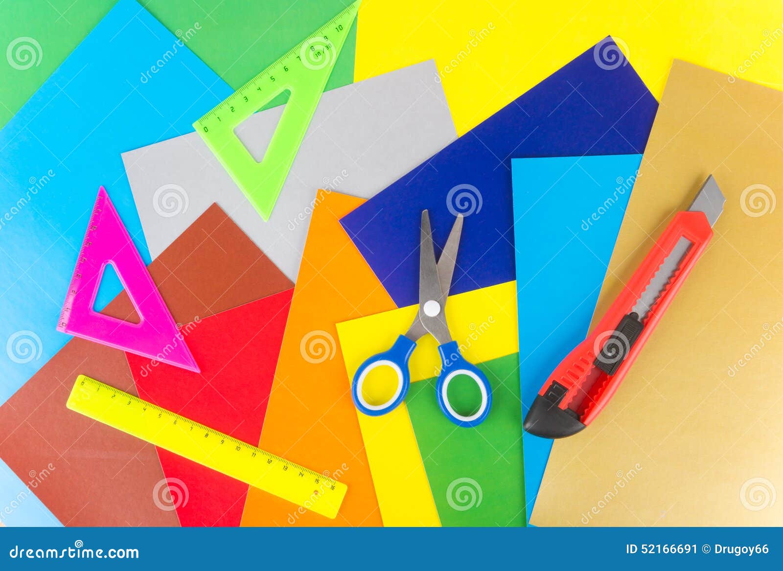 Triangles, Ruler, Scissors and Cutter on Colored Paper Stock Image ...