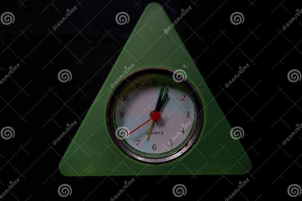 A Triangular Clock on Black Background. Stock Image - Image of abstract, accessory: 295020943