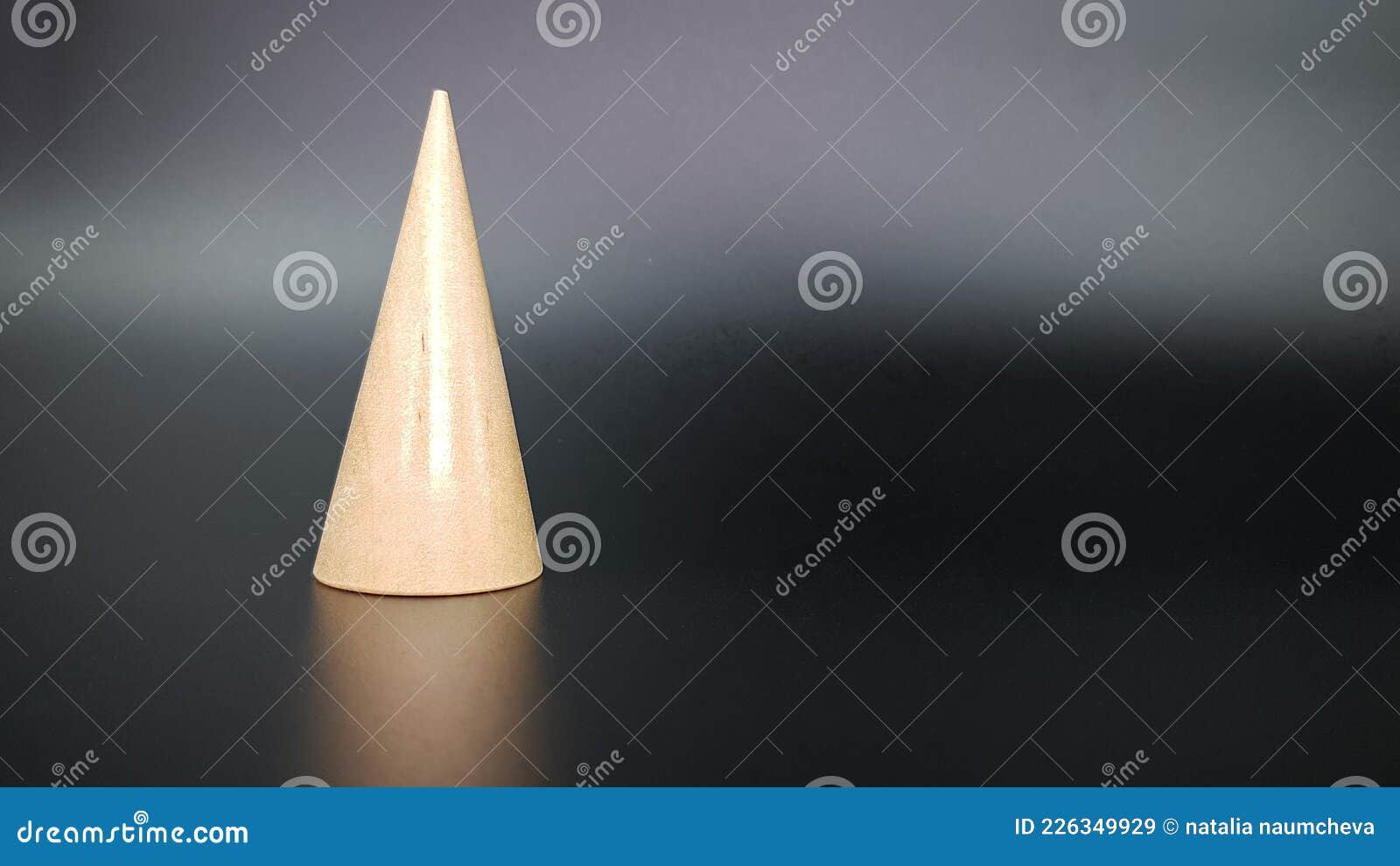 The Triangular Cone is Made of Wood on a Black Background. Various ...