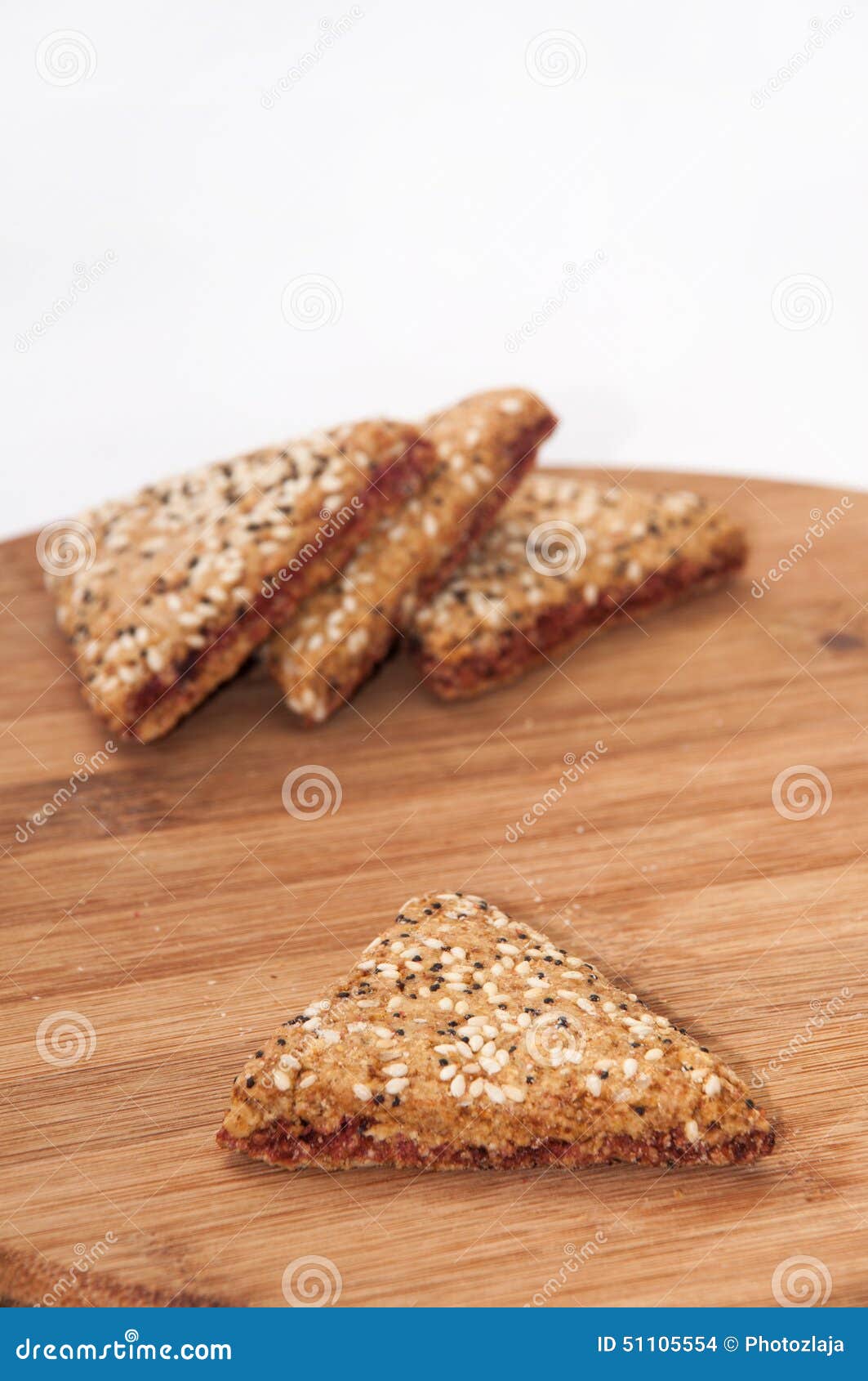 The Triangular Cookies with Cherries on a Kitchen Wooden Board Stock ...