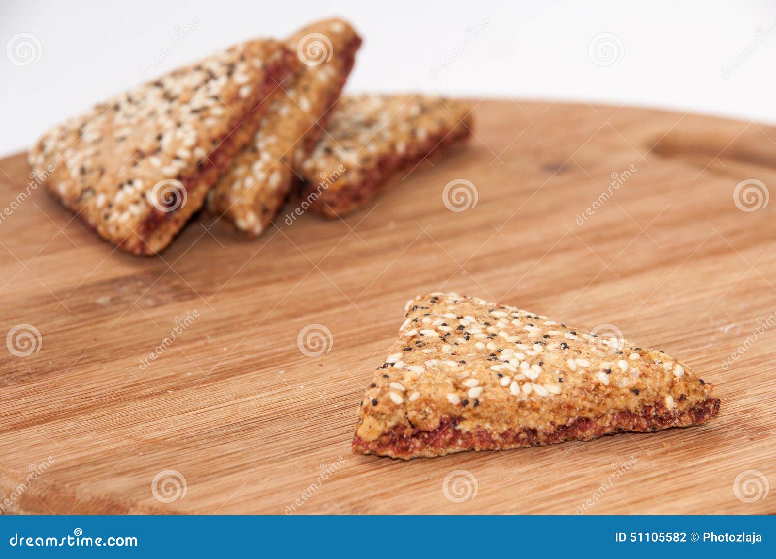 The Triangular Cookies with Cherries on a Kitchen Wooden Board Stock ...