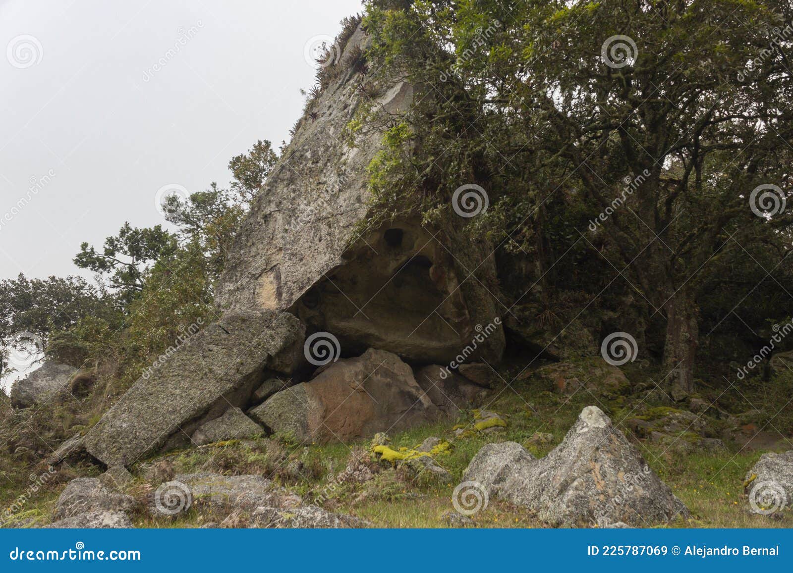 A Triangular Extrange Ancient Monolith with a Hole Surrounded by Trees ...