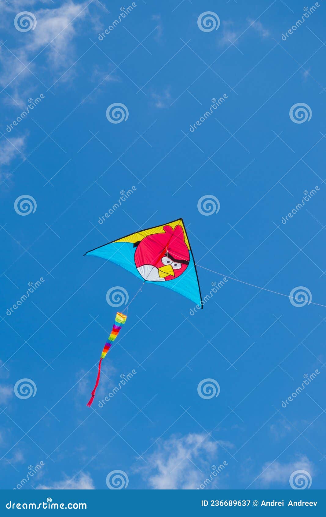 Triangular Kite with Multicolored Tail and the Image of a Round Red ...