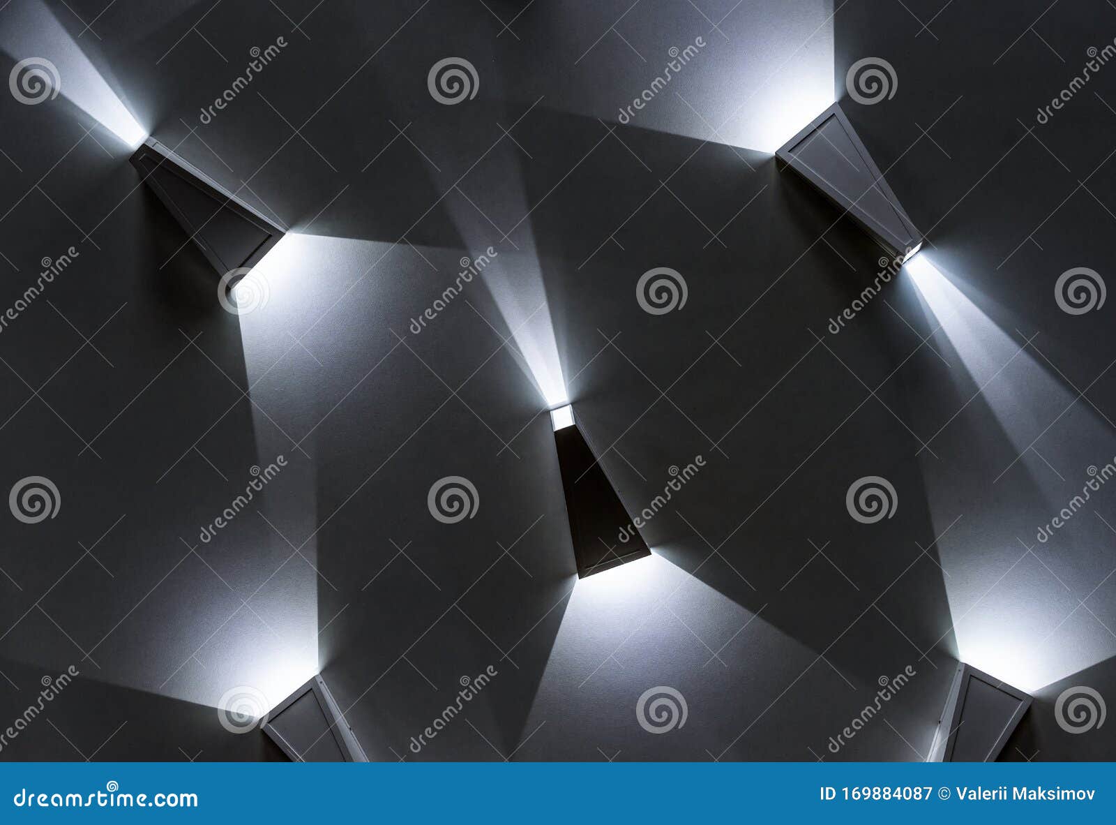 Triangular LED Lamps with a White Glow. LED Lighting in the Interior ...