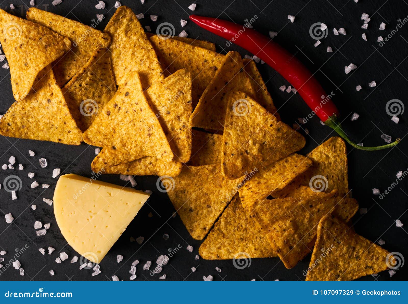 Triangular Nachos chips stock image. Image of golden - 107097329