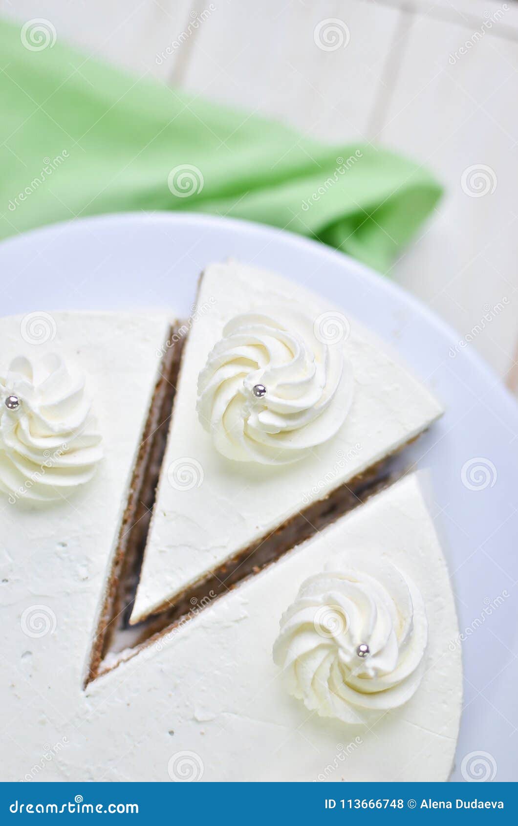 Triangular Piece of Tender Biscuit Cake in White Cream with Cream Peaks ...