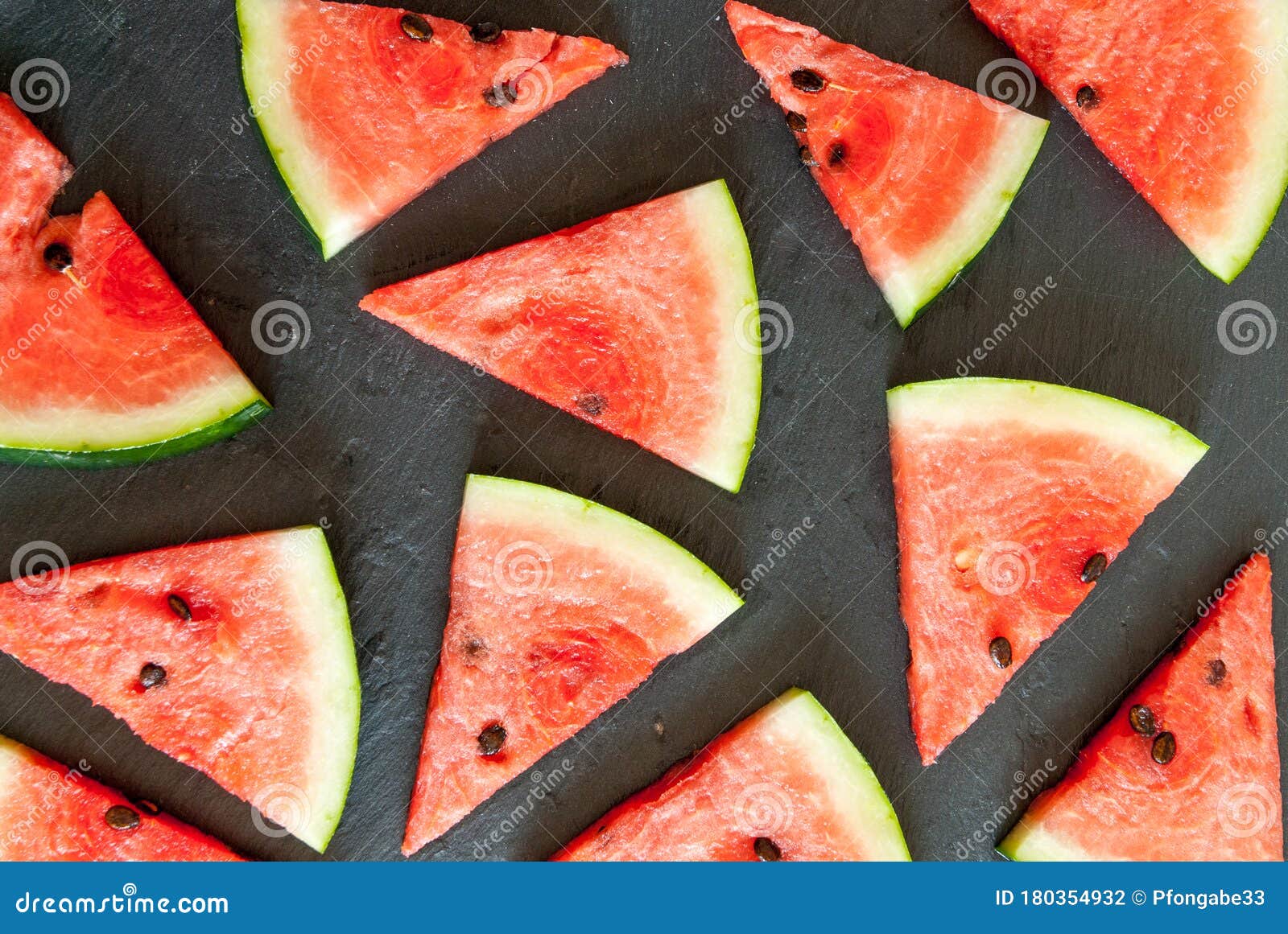 Triangular Pieces of Water Melon Spread on Black Stock Photo - Image of ...