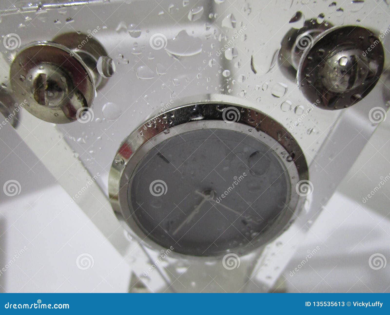 Triangular Prism Desk Clock Wet with Water Droplets. Stock Image ...