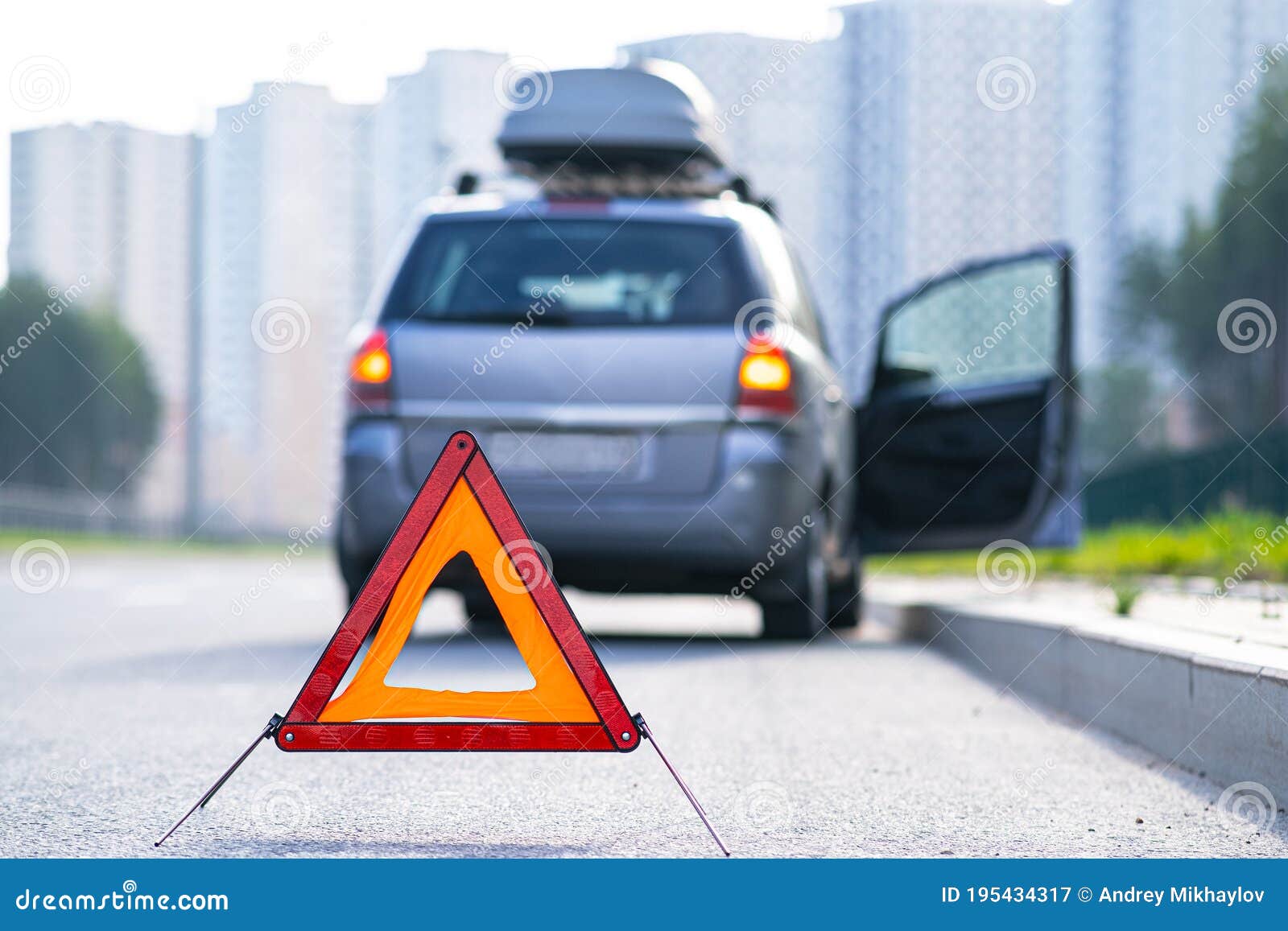 Triangular Red Retro-reflective Sign of Accident on the Road. Car ...