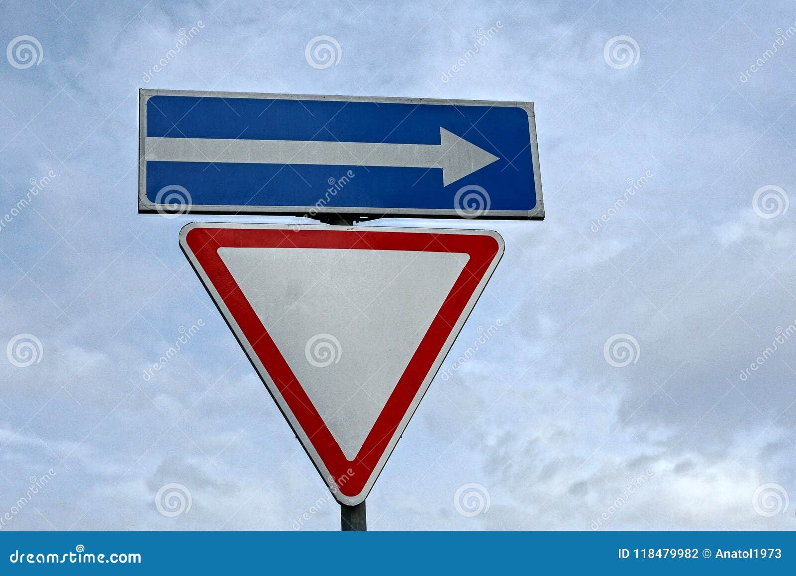 Triangular Road Sign and Arrow on the Sky Background Stock Photo ...