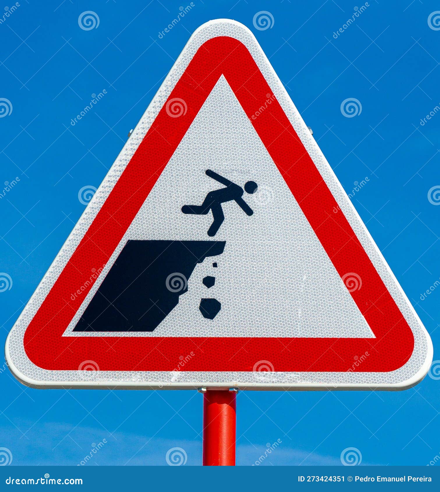 Triangular Road Sign of Danger of Person Falling on Cliff Under Blue ...