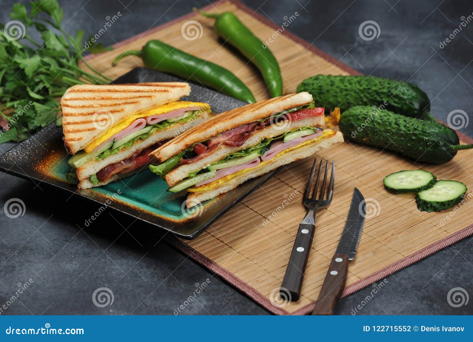 Triangular Shaped Sandwiches with Ham and Omelet on a Plate Stock Photo ...