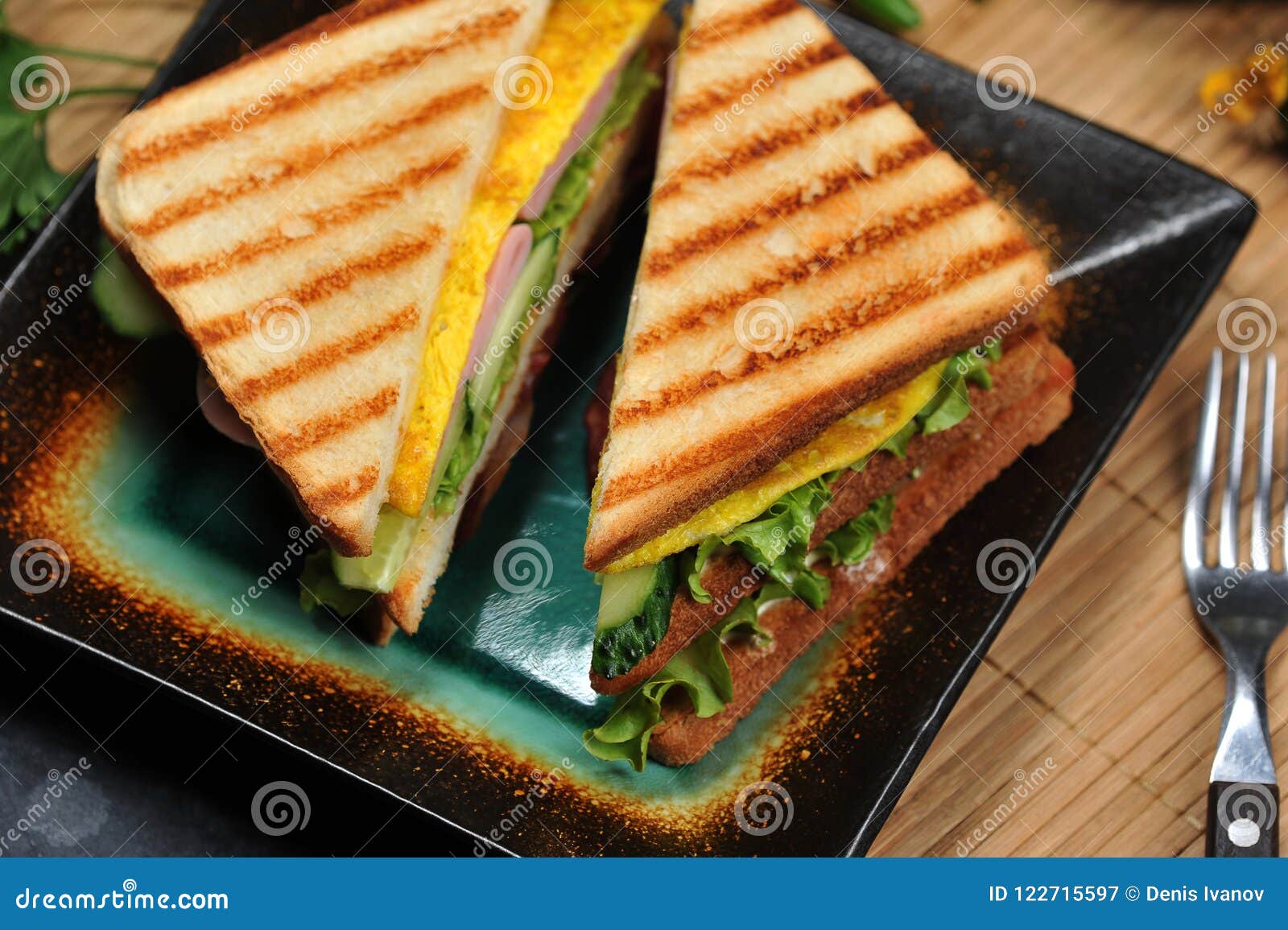 Triangular Shaped Sandwiches with Ham and Omelet on a Plate Stock Image ...