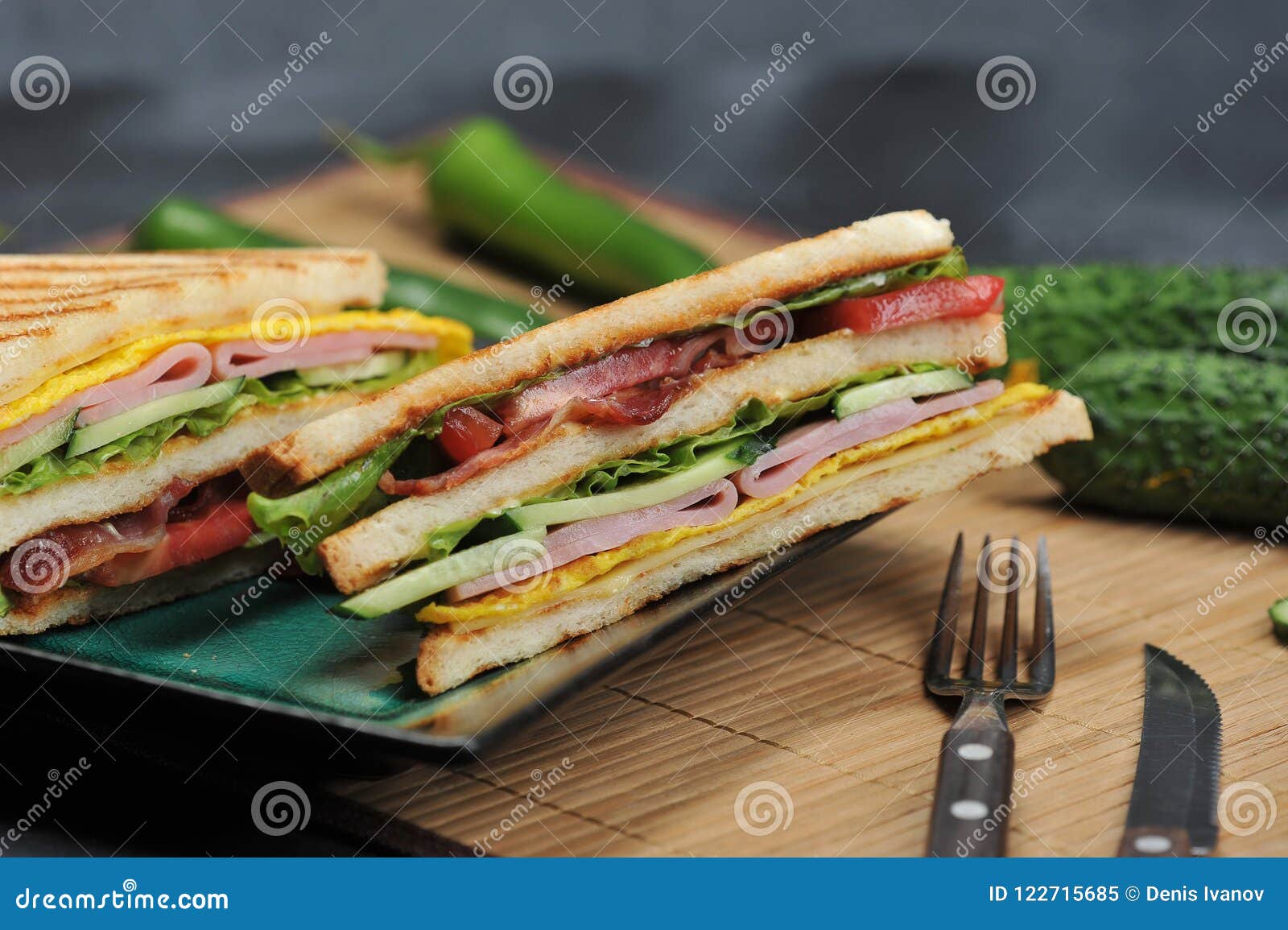 Triangular Shaped Sandwiches with Ham and Omelet on a Plate Stock Image ...