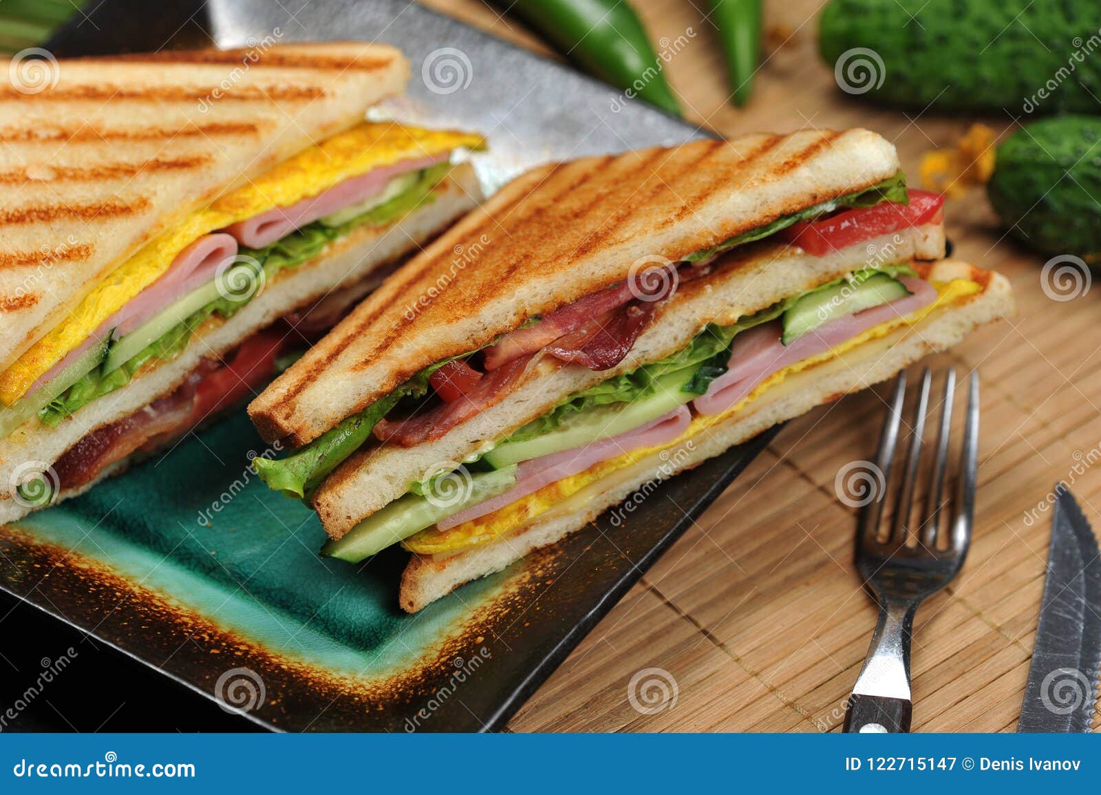 Triangular Shaped Sandwiches with Ham and Omelet on a Plate Stock Image ...