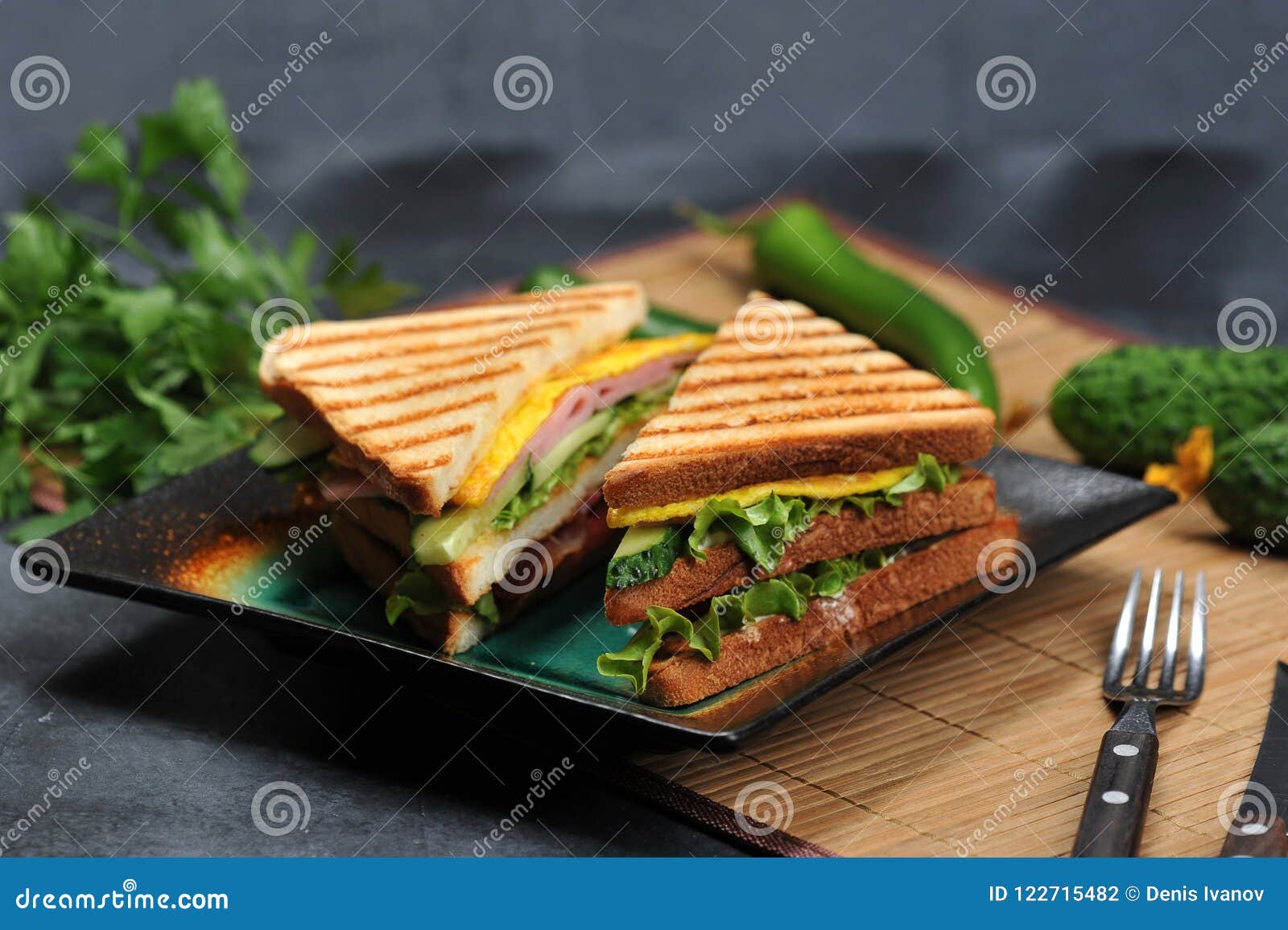 Triangular Shaped Sandwiches with Ham and Omelet on a Plate Stock Photo ...
