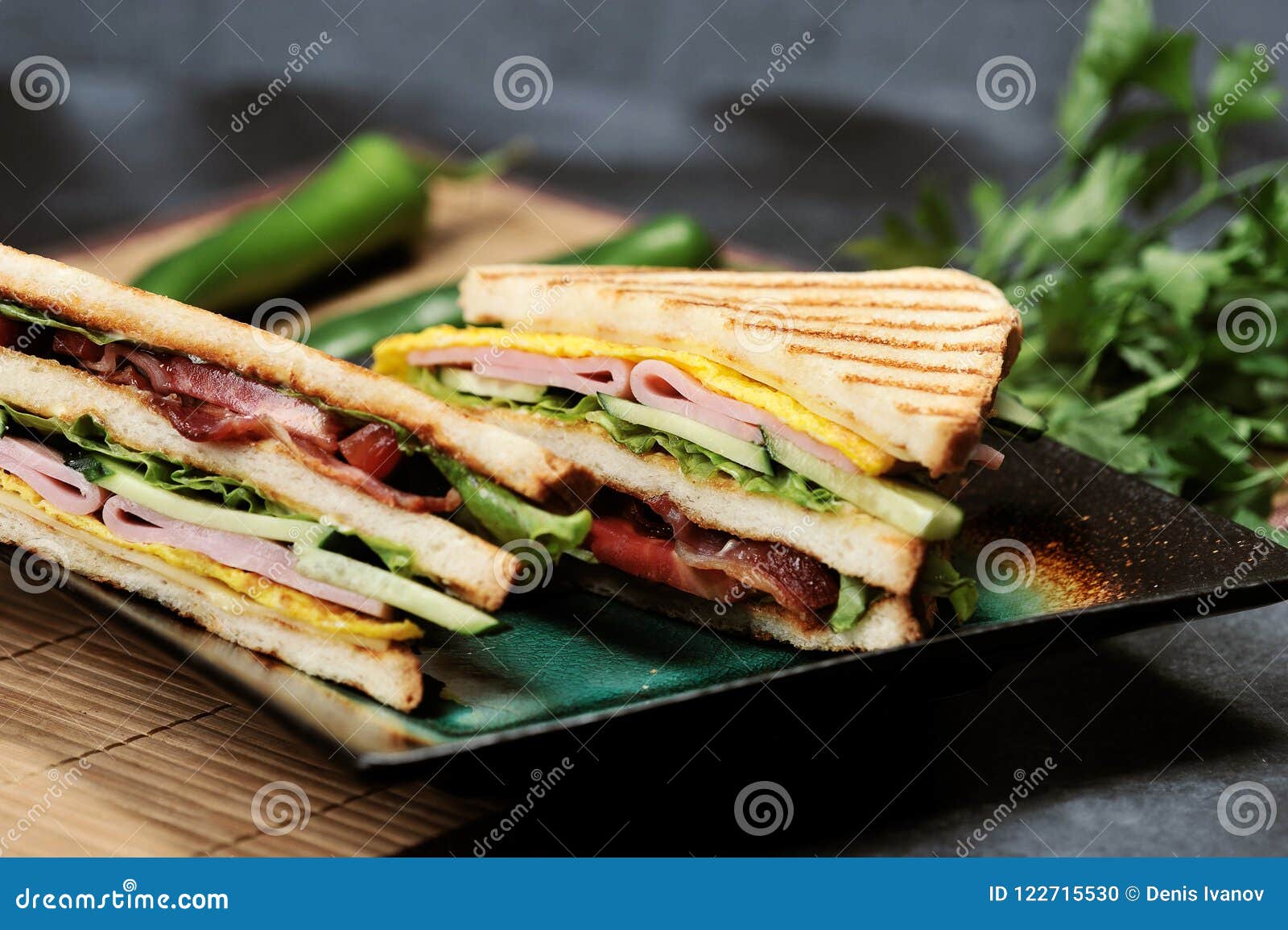 Triangular Shaped Sandwiches with Ham and Omelet on a Plate Stock Photo ...
