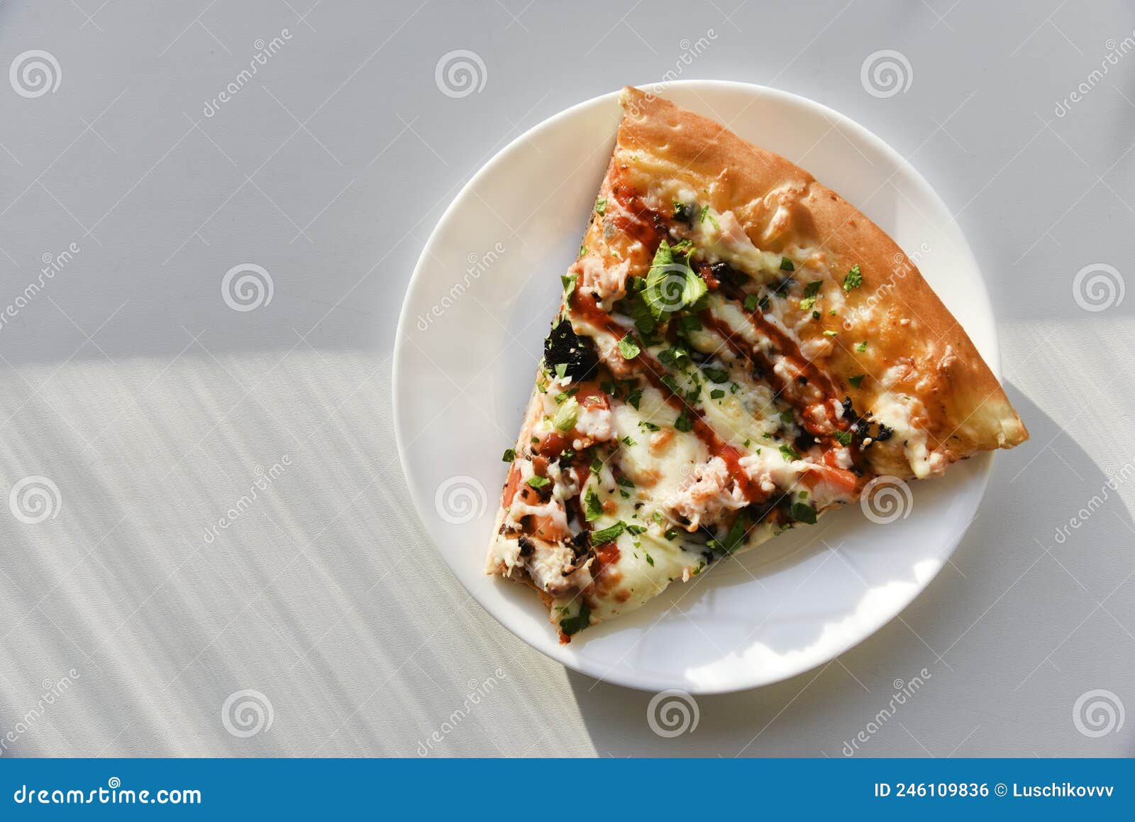 Triangular Slice of Pizza on a White Plate Stock Photo - Image of ...