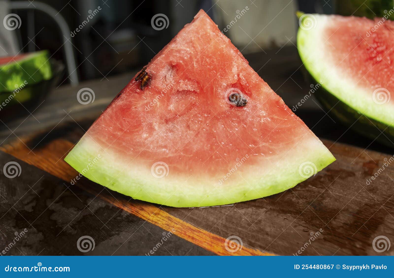A Triangular Slice of Watermelon on a Wooden Table. Beautiful Slice of ...