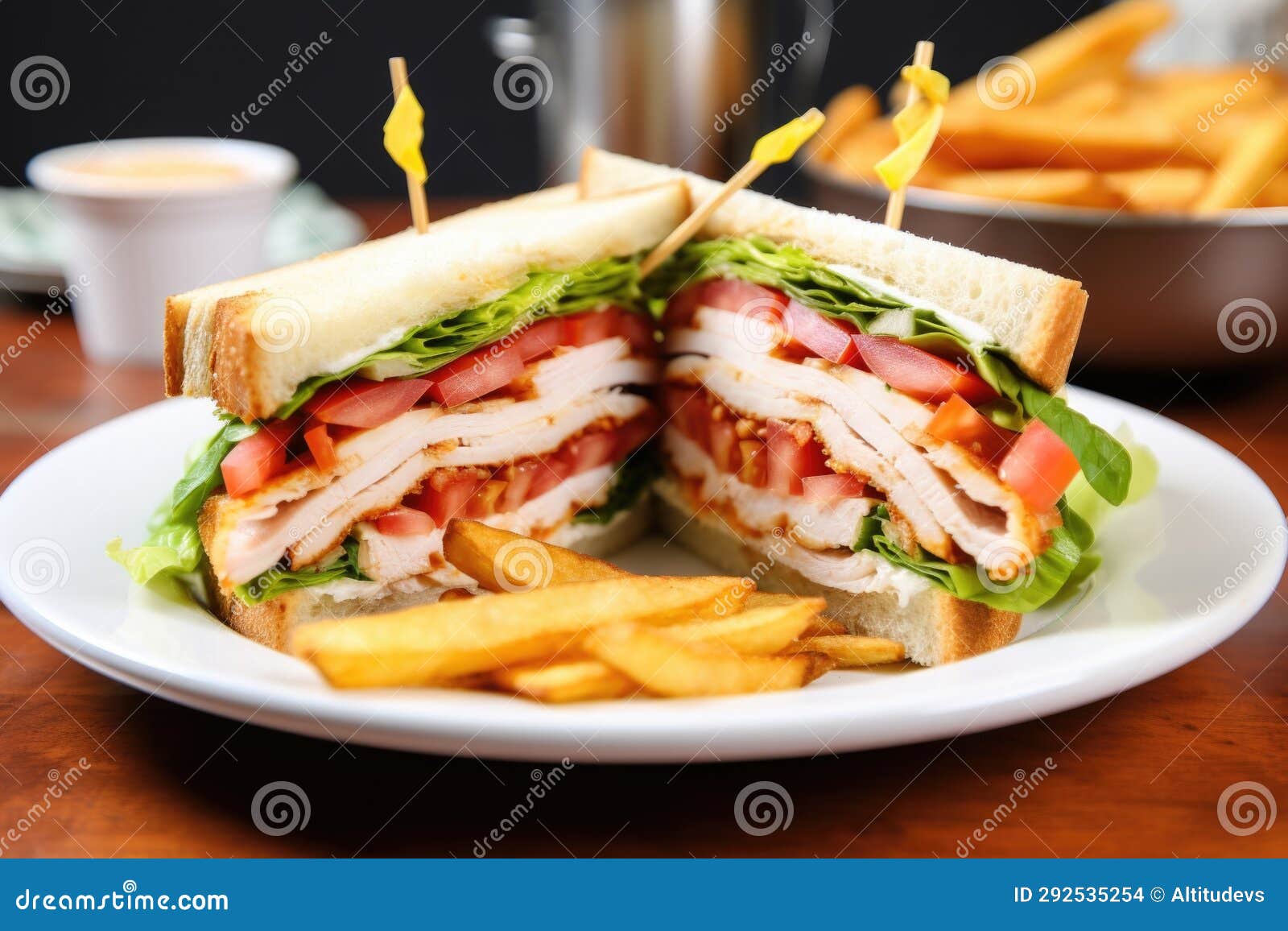 Triangular Sliced Chicken Club Sandwich on a Ceramic Plate Stock Photo ...