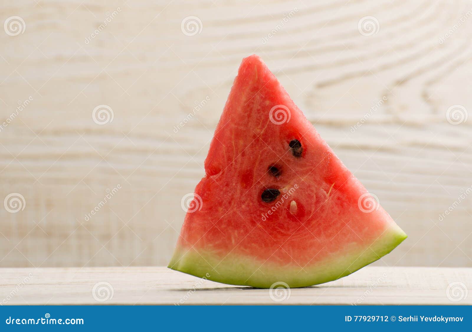 Triangular Watermelon Slice on a Light Wooden Background Stock Photo ...